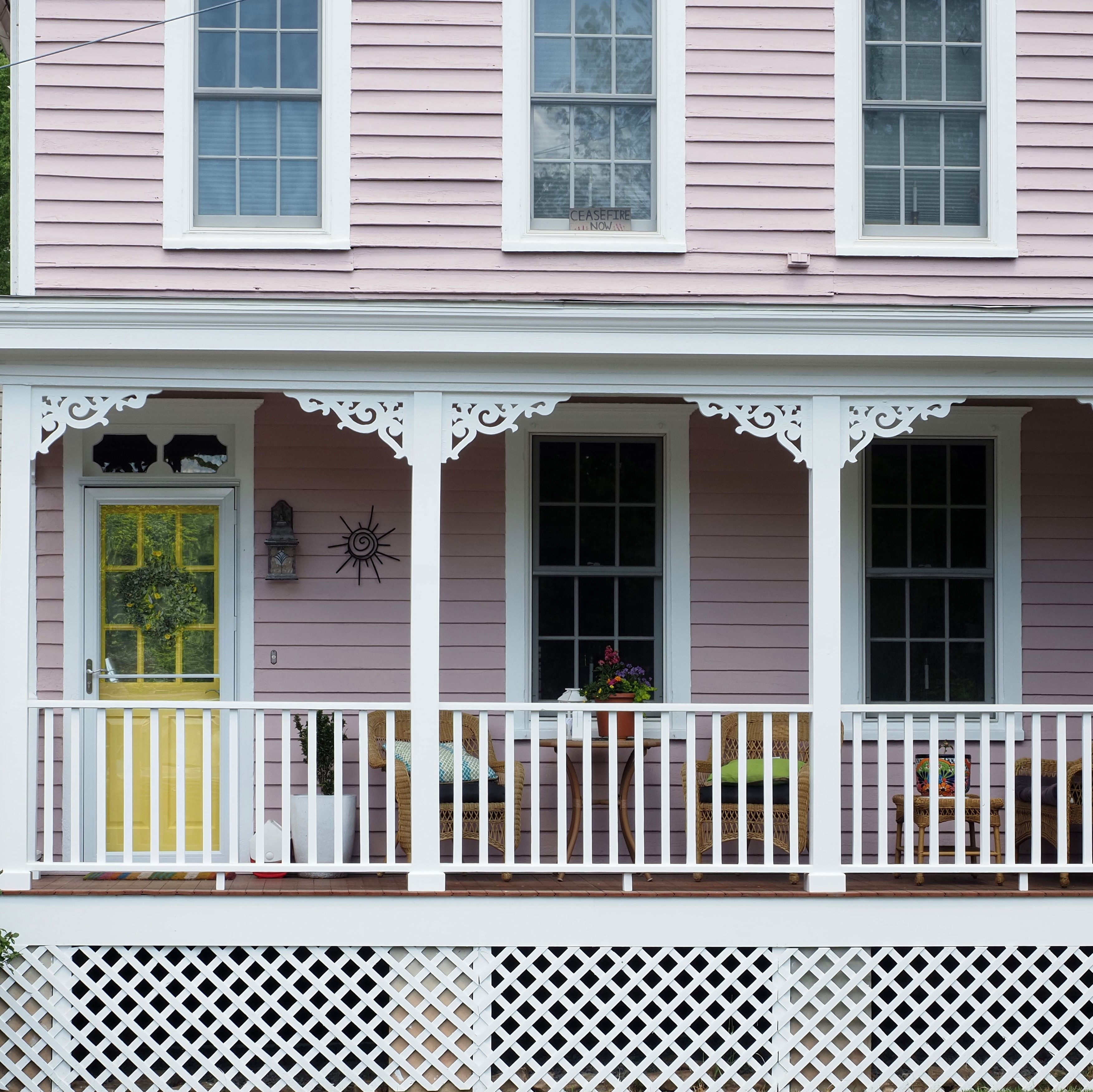 Charming Pink House with Ornate Porch in Stockton · Free Stock Photo