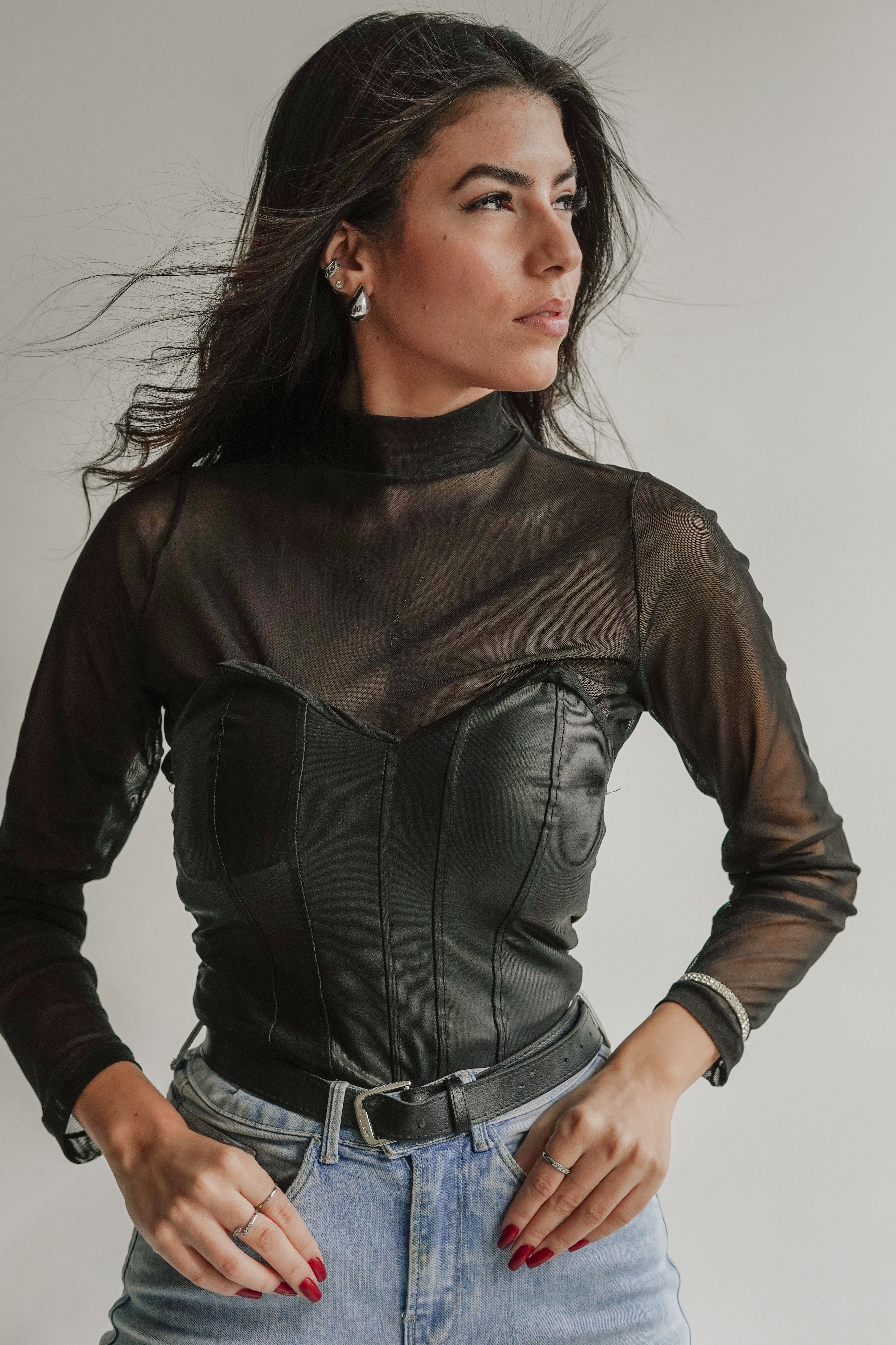 Fashionable Woman in Black Sheer Top · Free Stock Photo