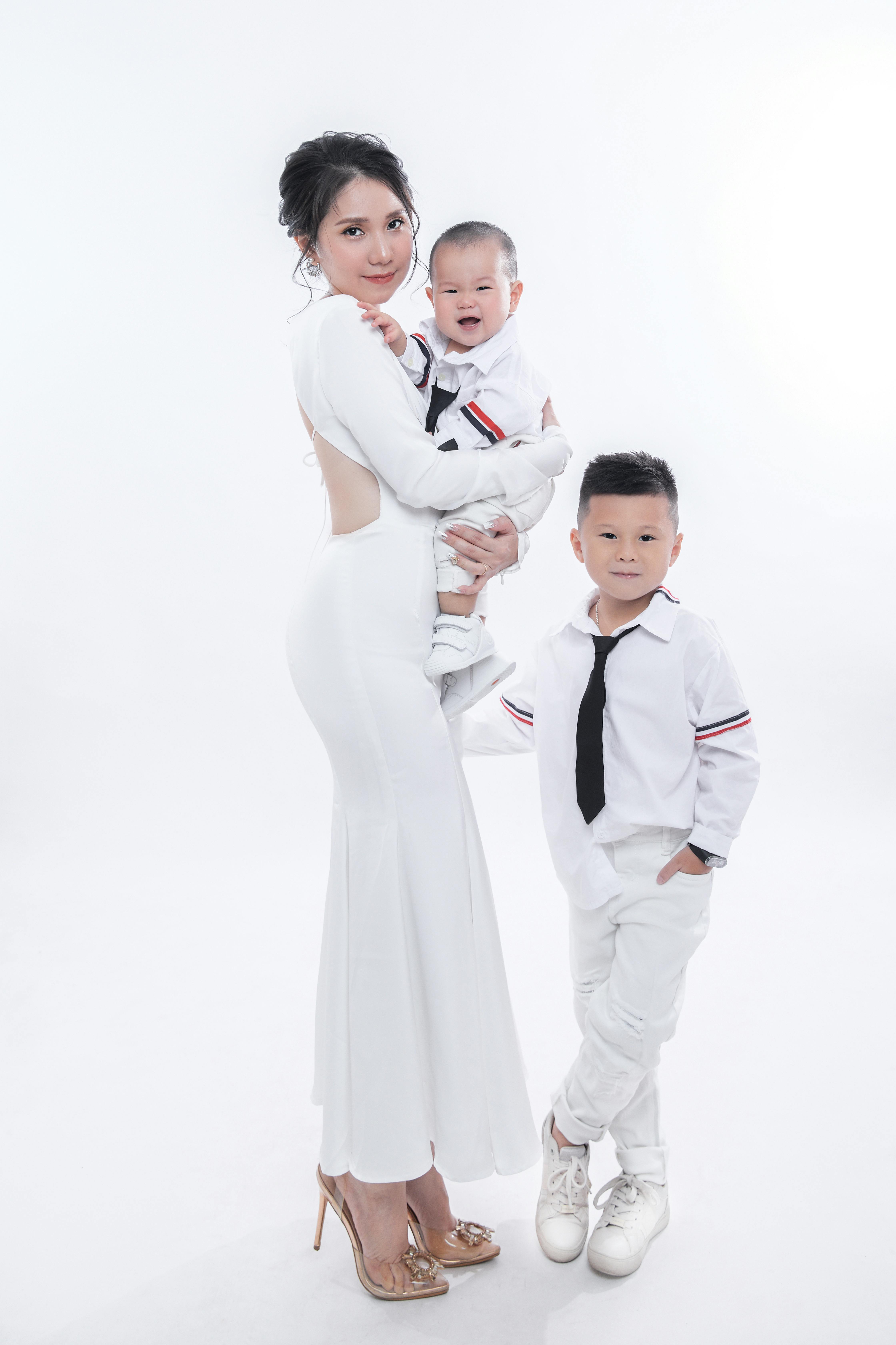 Elegant Family Portrait in All White Attire · Free Stock Photo
