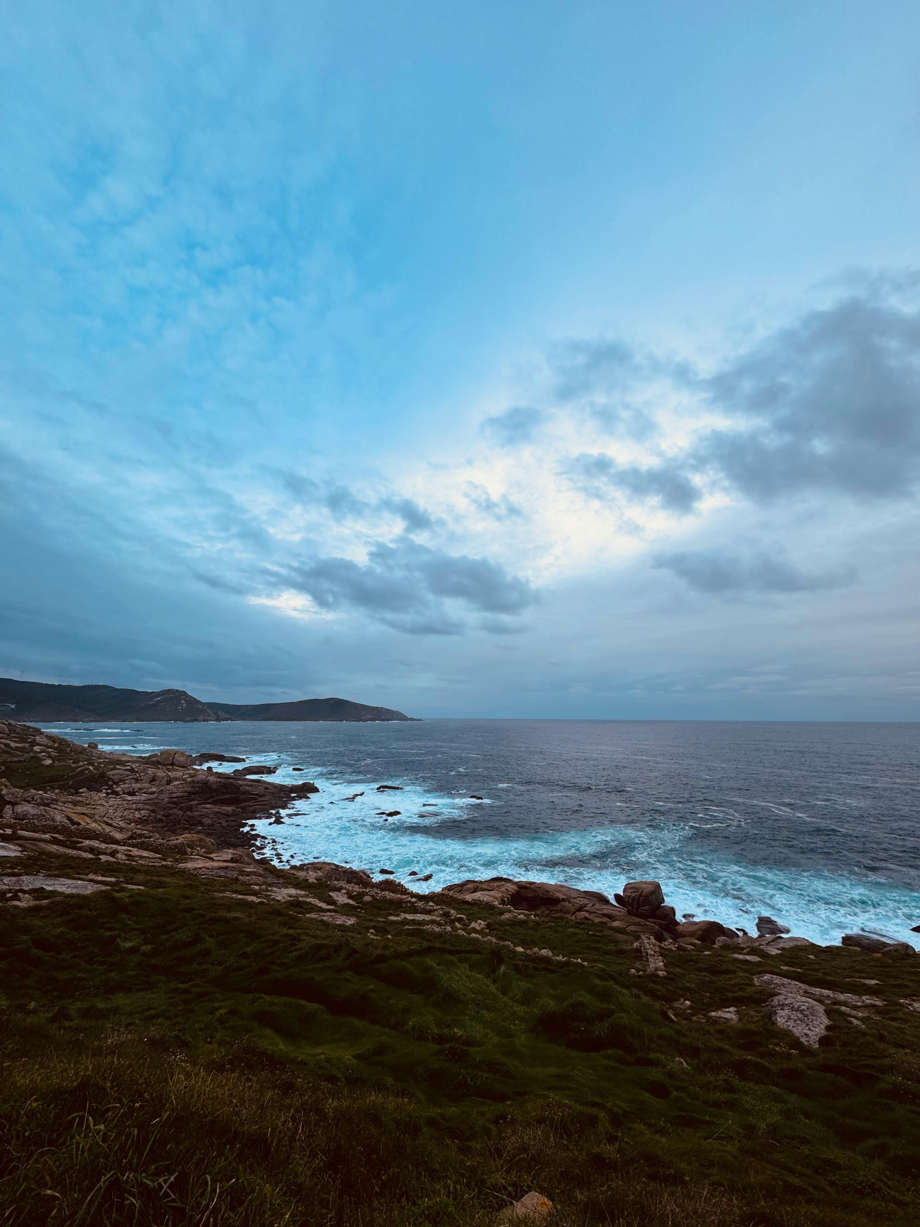 Scenic Coastal View with Dramatic Sky and Waves · Free Stock Photo