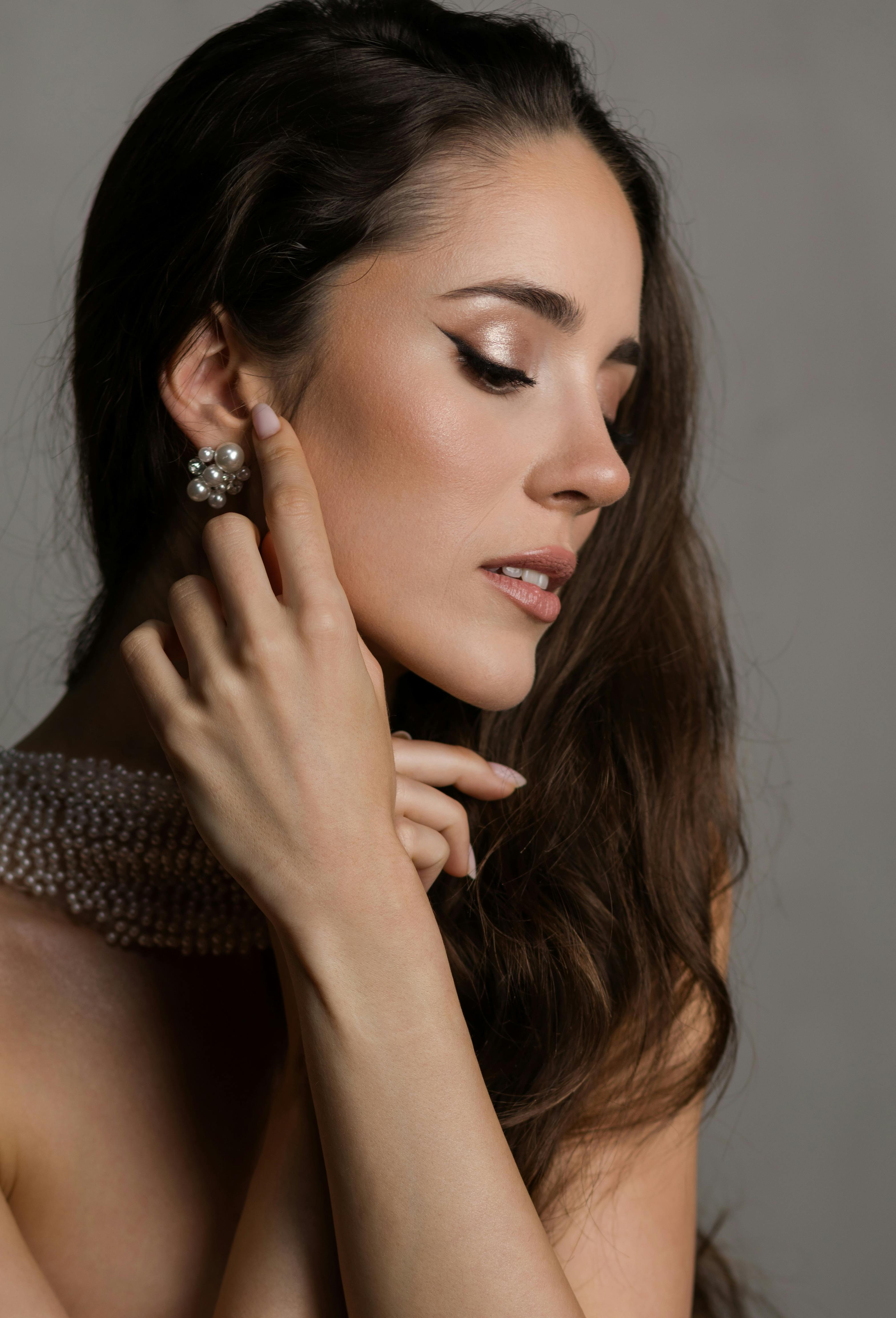 Woman Touching Gold Necklace · Free Stock Photo