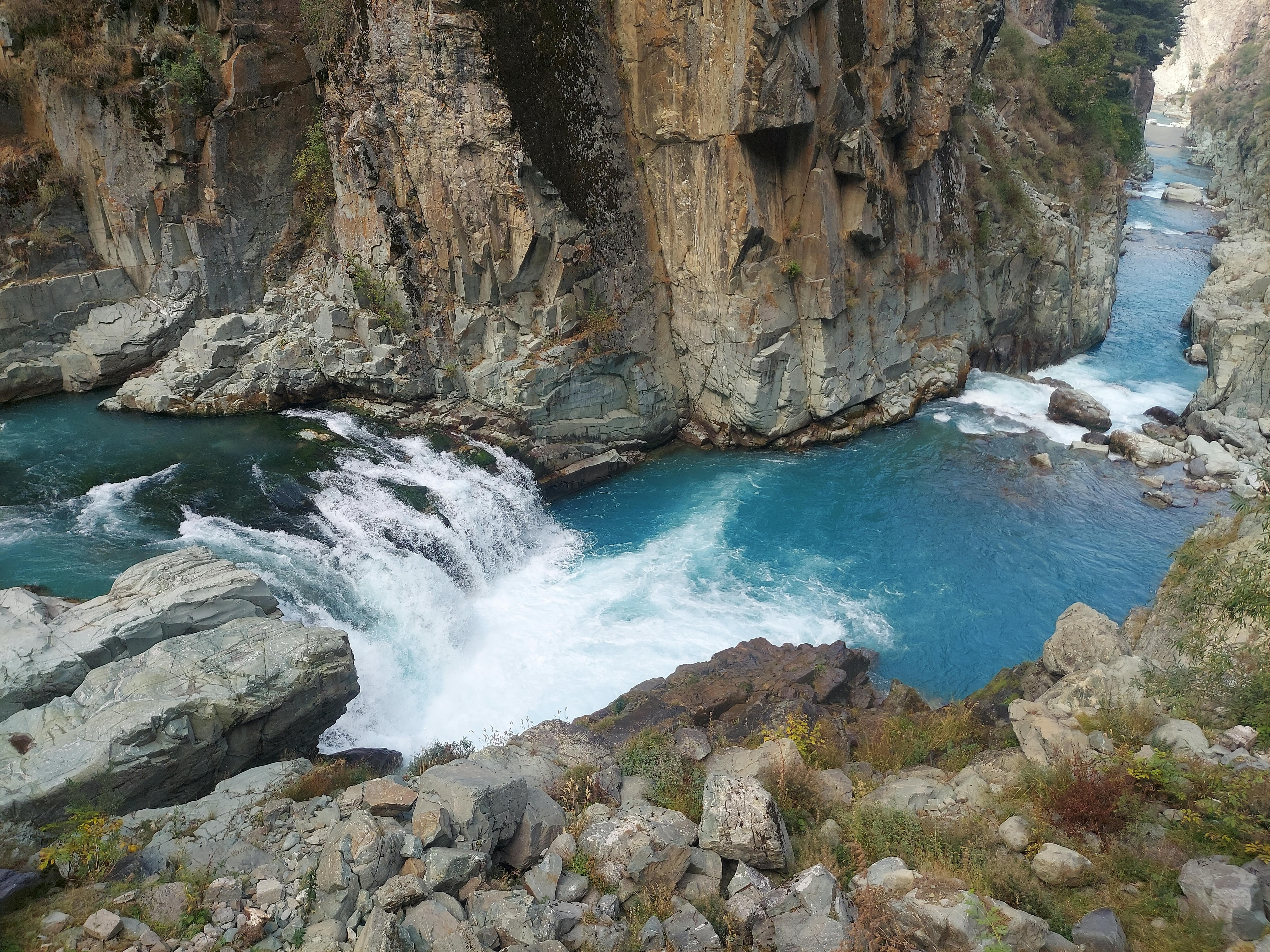 Stunning Blue River Flowing Through Rocky Gorge · Free Stock Photo