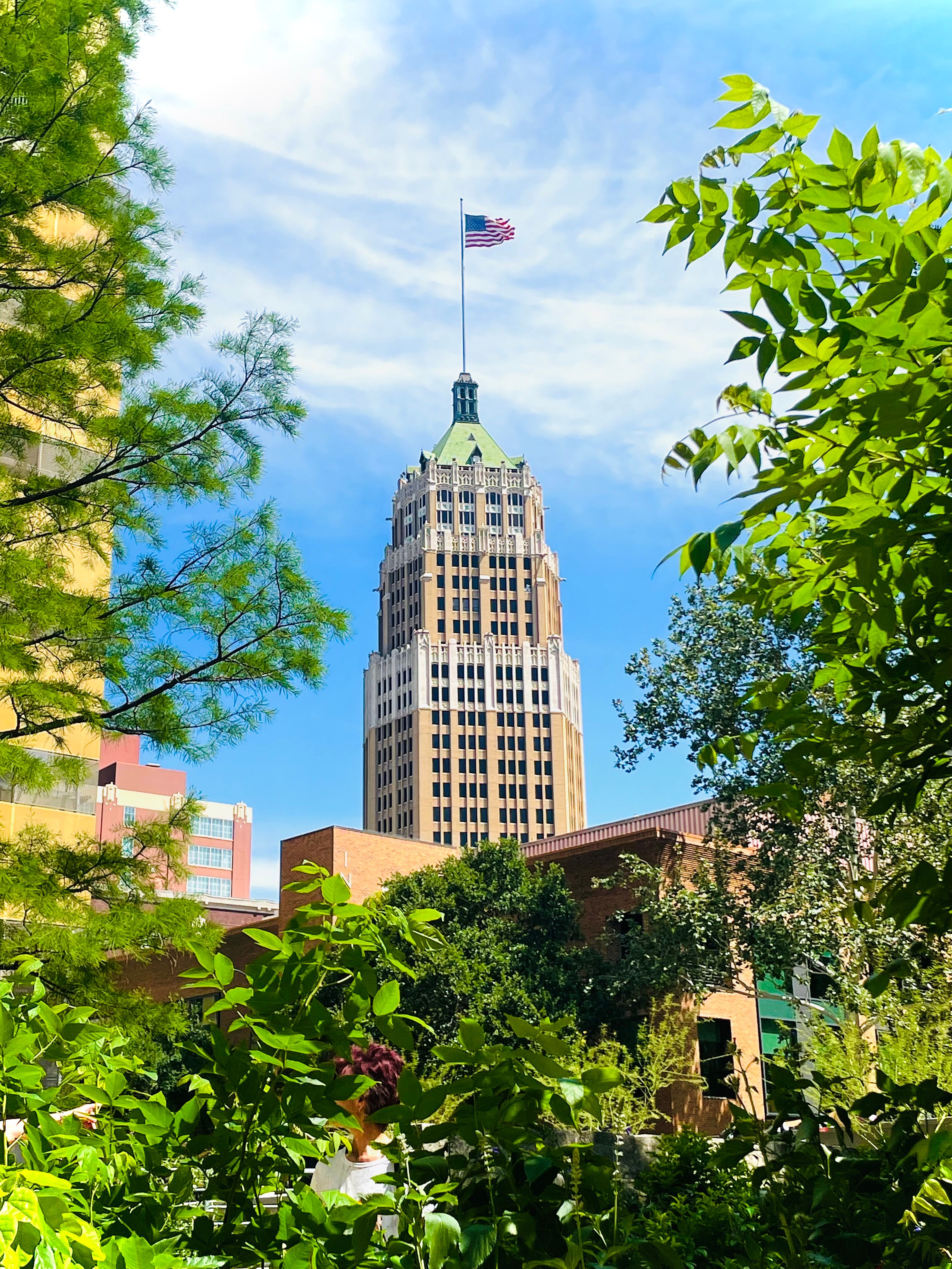 Iconic Tower Amidst Lush Greenery on a Sunny Day · Free Stock Photo