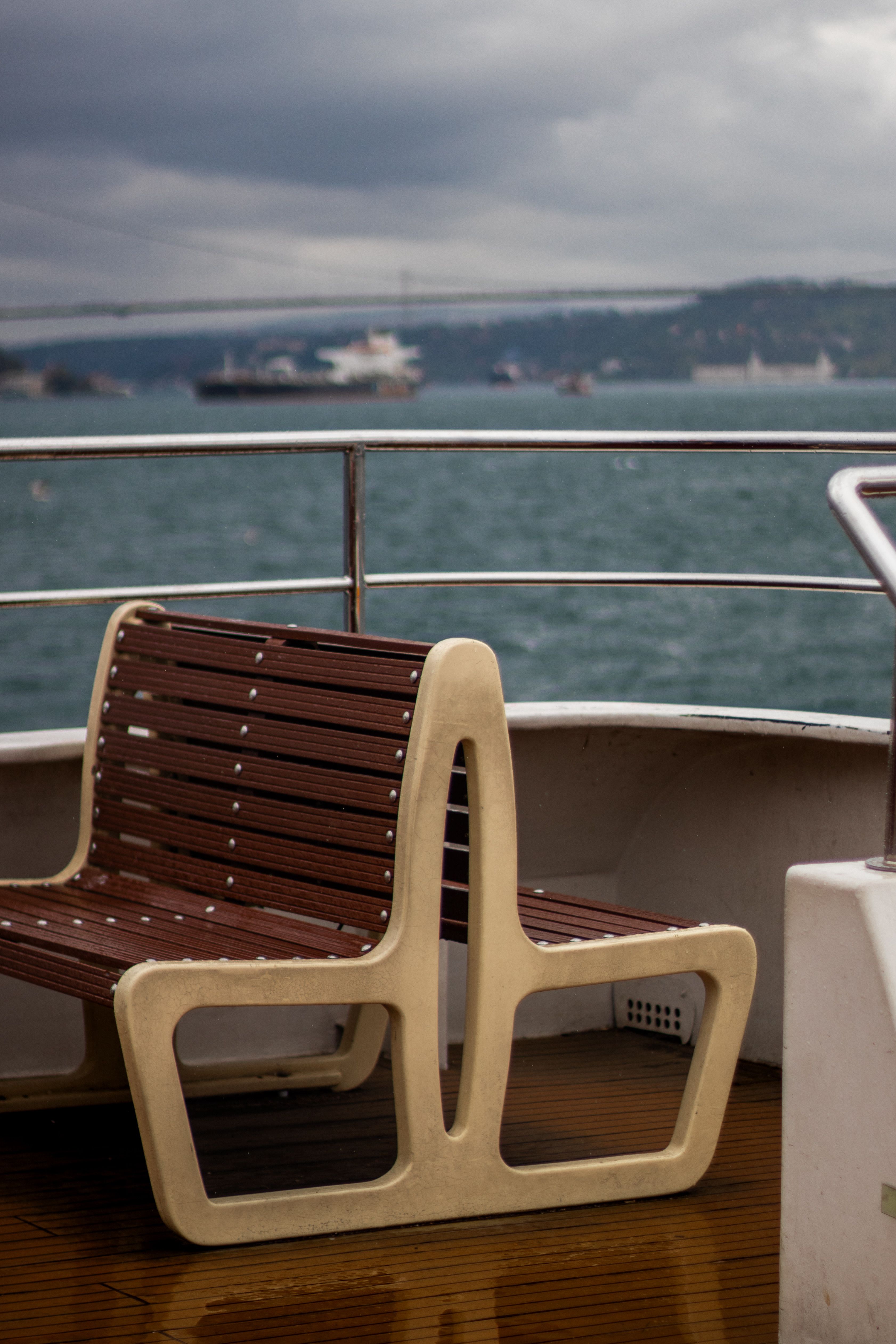 Empty Boat Deck with Ocean and Overcast Sky View · Free Stock Photo