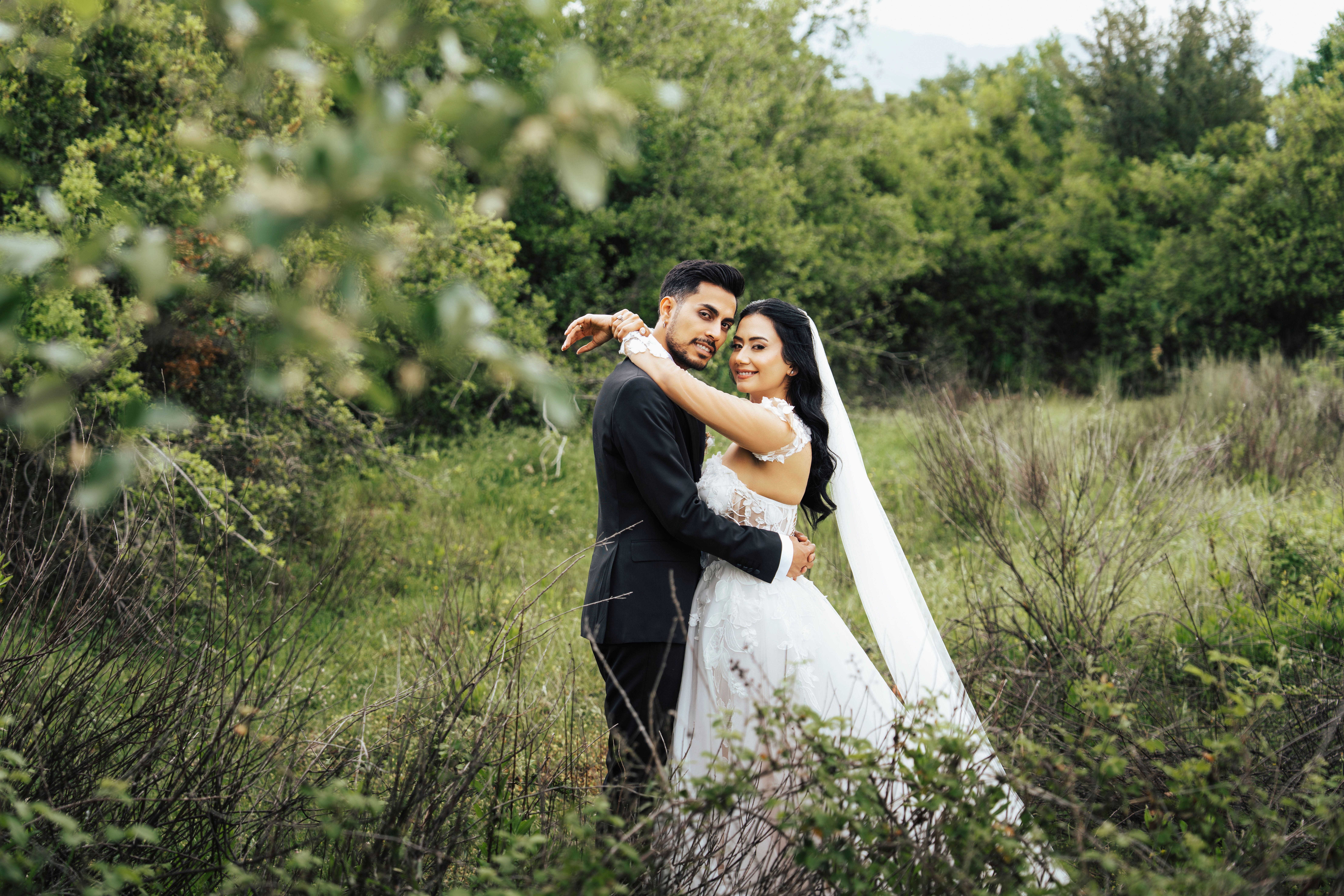 Romantic Outdoor Wedding Embrace in Nature · Free Stock Photo