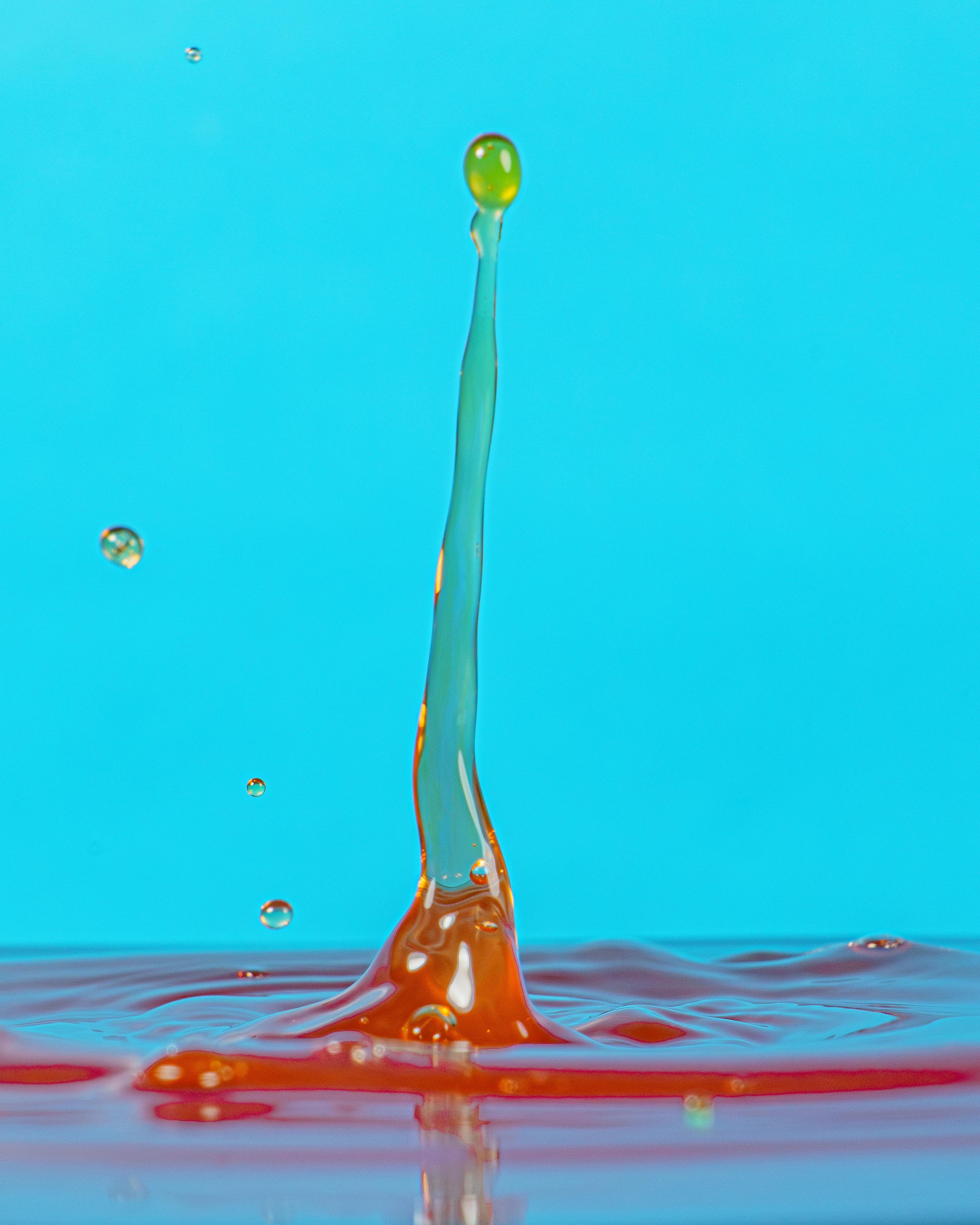 Dynamic Water Droplet Splash Art in Vibrant Colors · Free Stock Photo