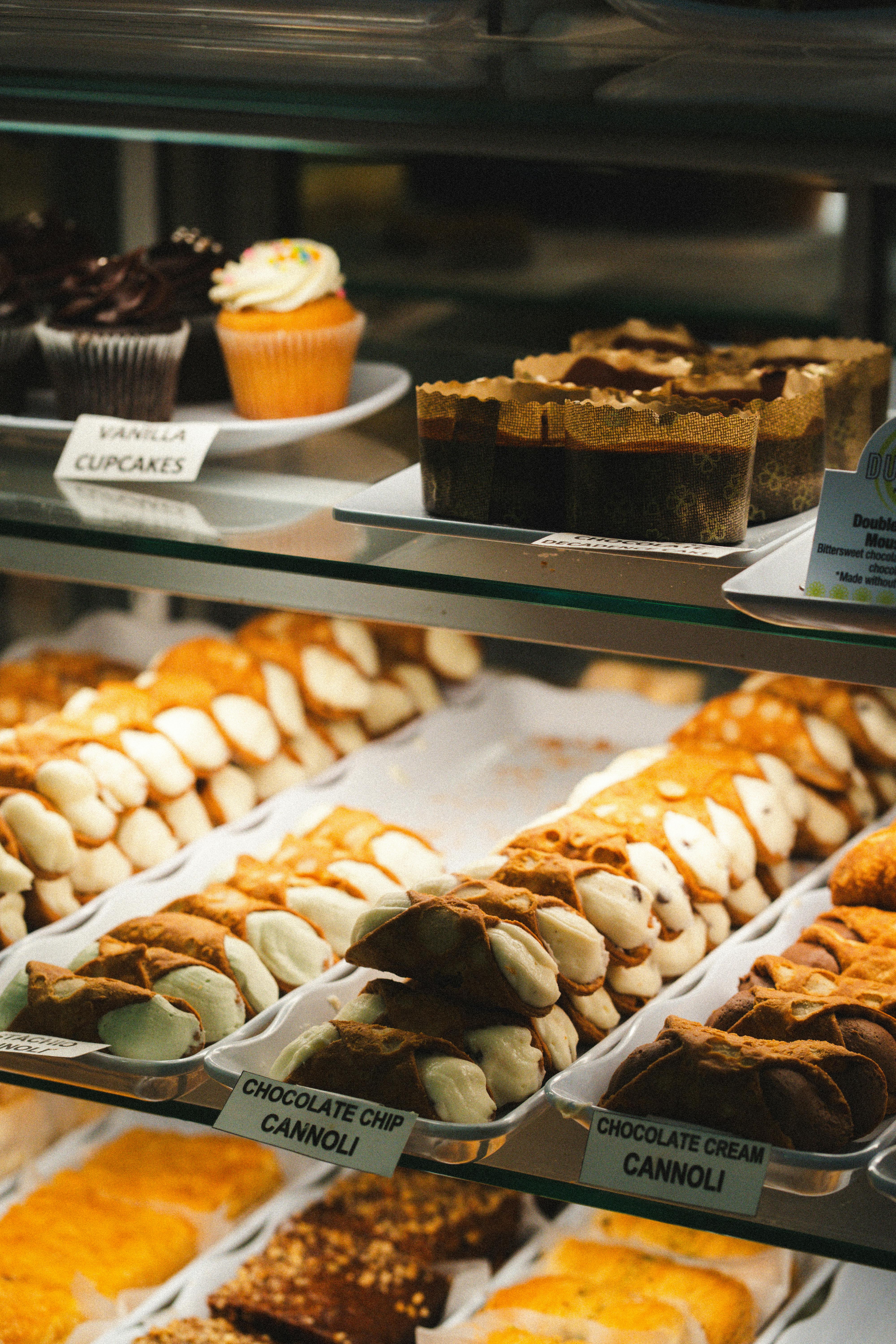 Pastries On Clear Glass Display Counter · Free Stock Photo