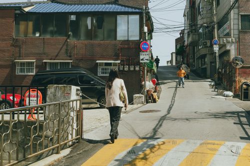 Child with Backpack on Seoul Street in Spring · Free Stock Photo