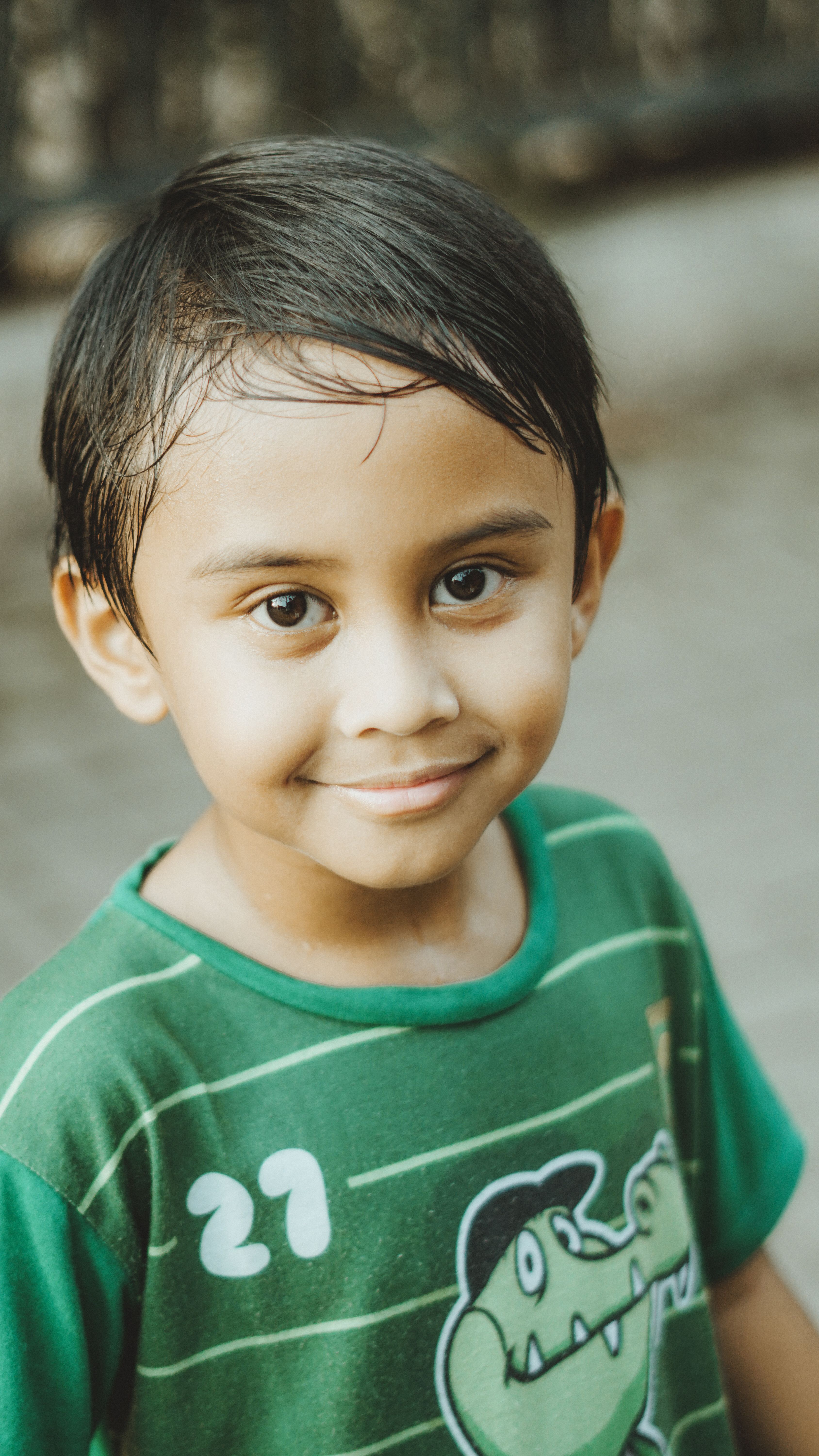 Smiling Child in Green T-shirt Outdoors · Free Stock Photo