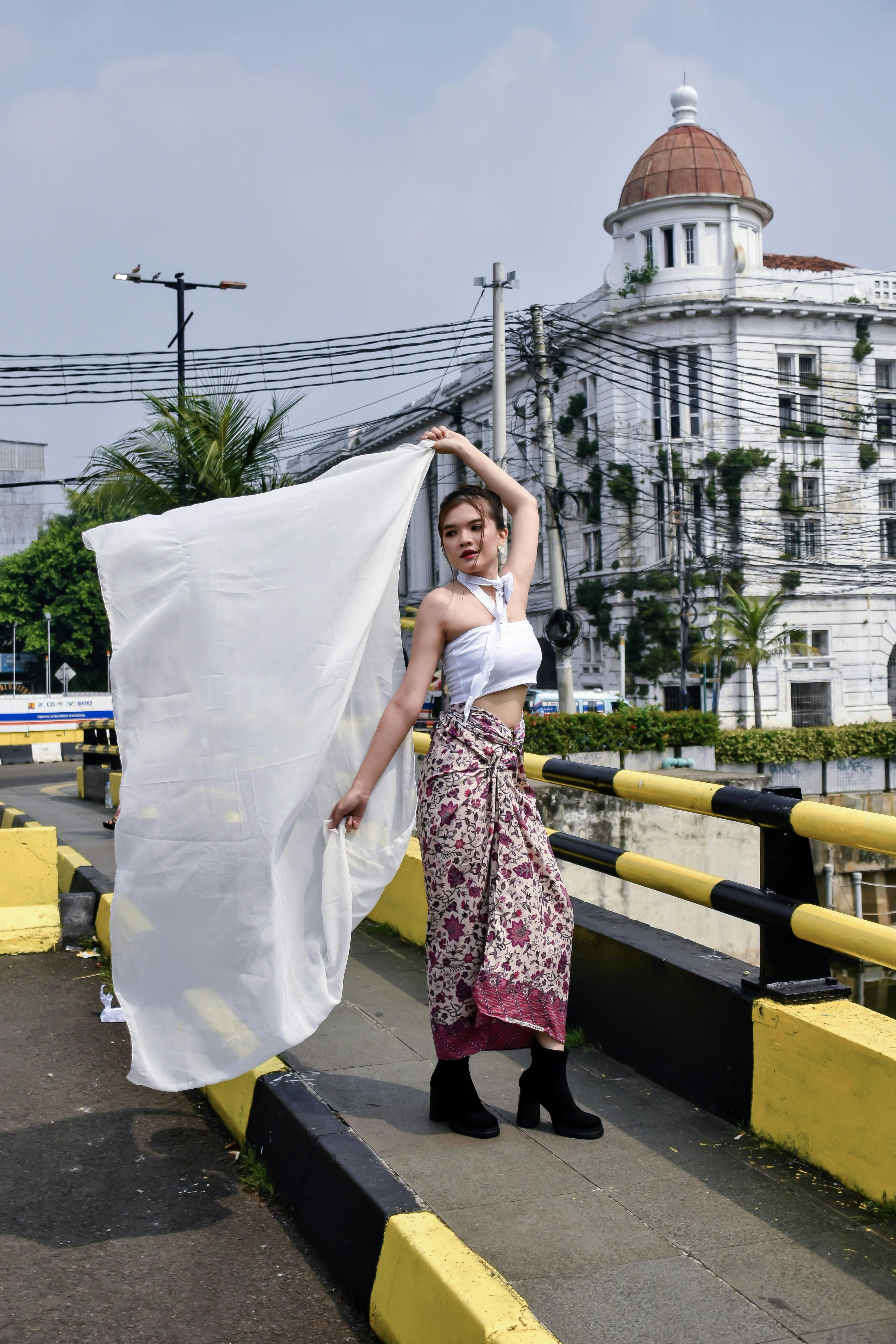 Woman Posing with Scarf in Urban Street Setting · Free Stock Photo