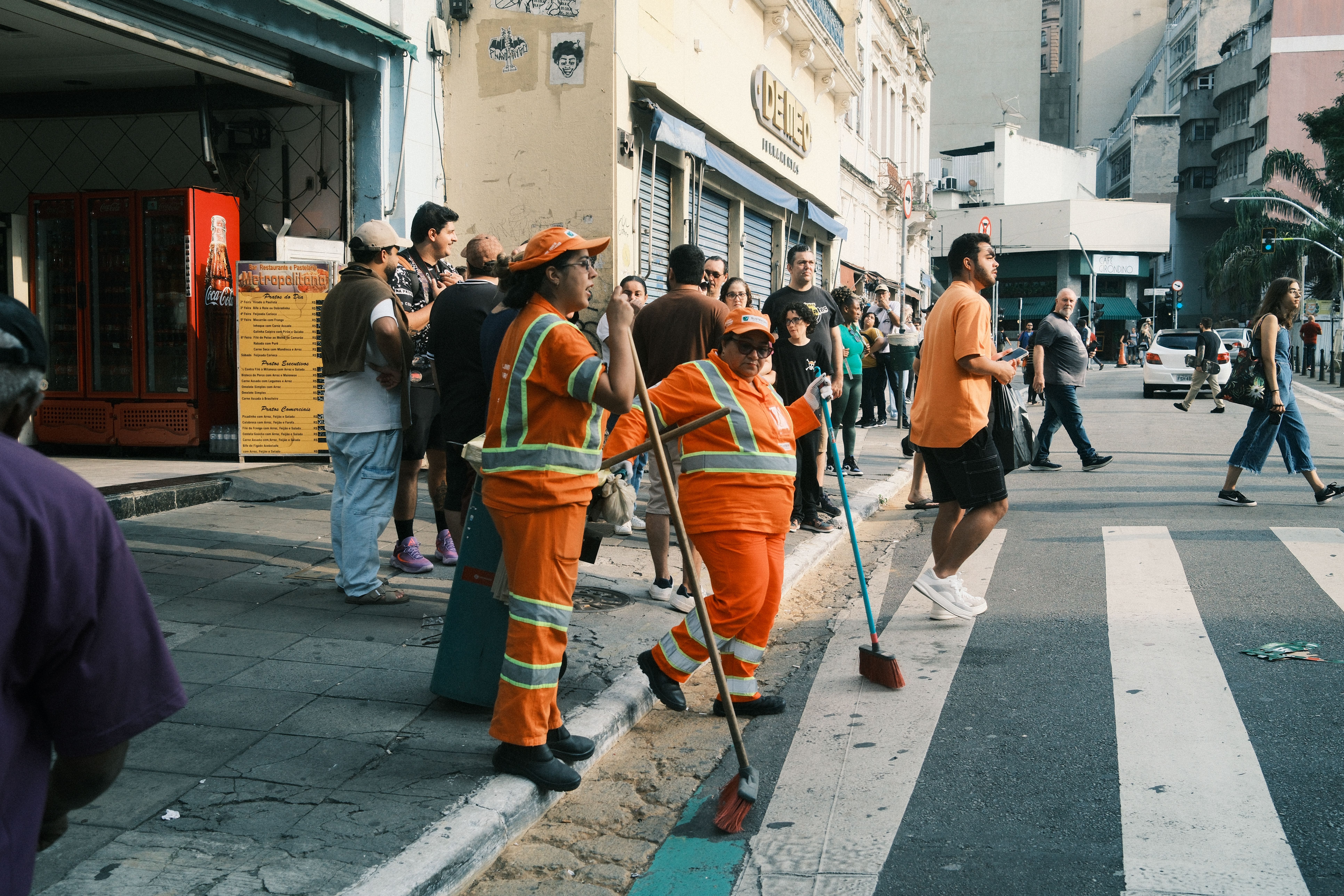 Urban Street Scene with City Workers and Pedestrians · Free Stock Photo