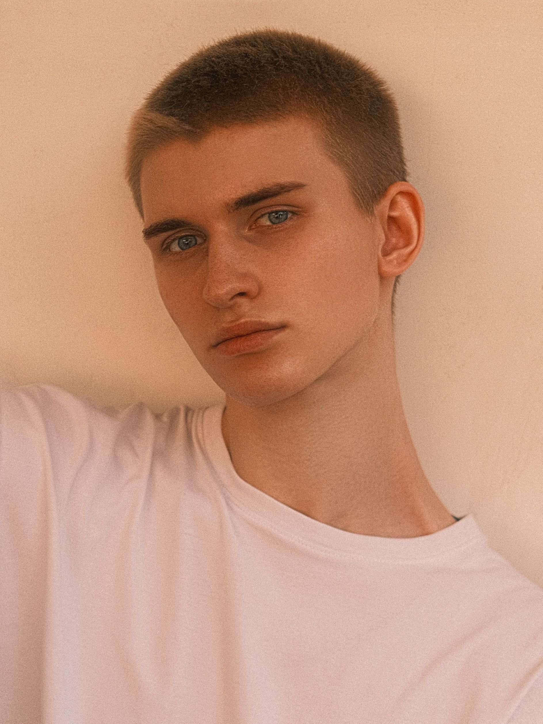 Young Adult in Minimalist Warm Portrait · Free Stock Photo