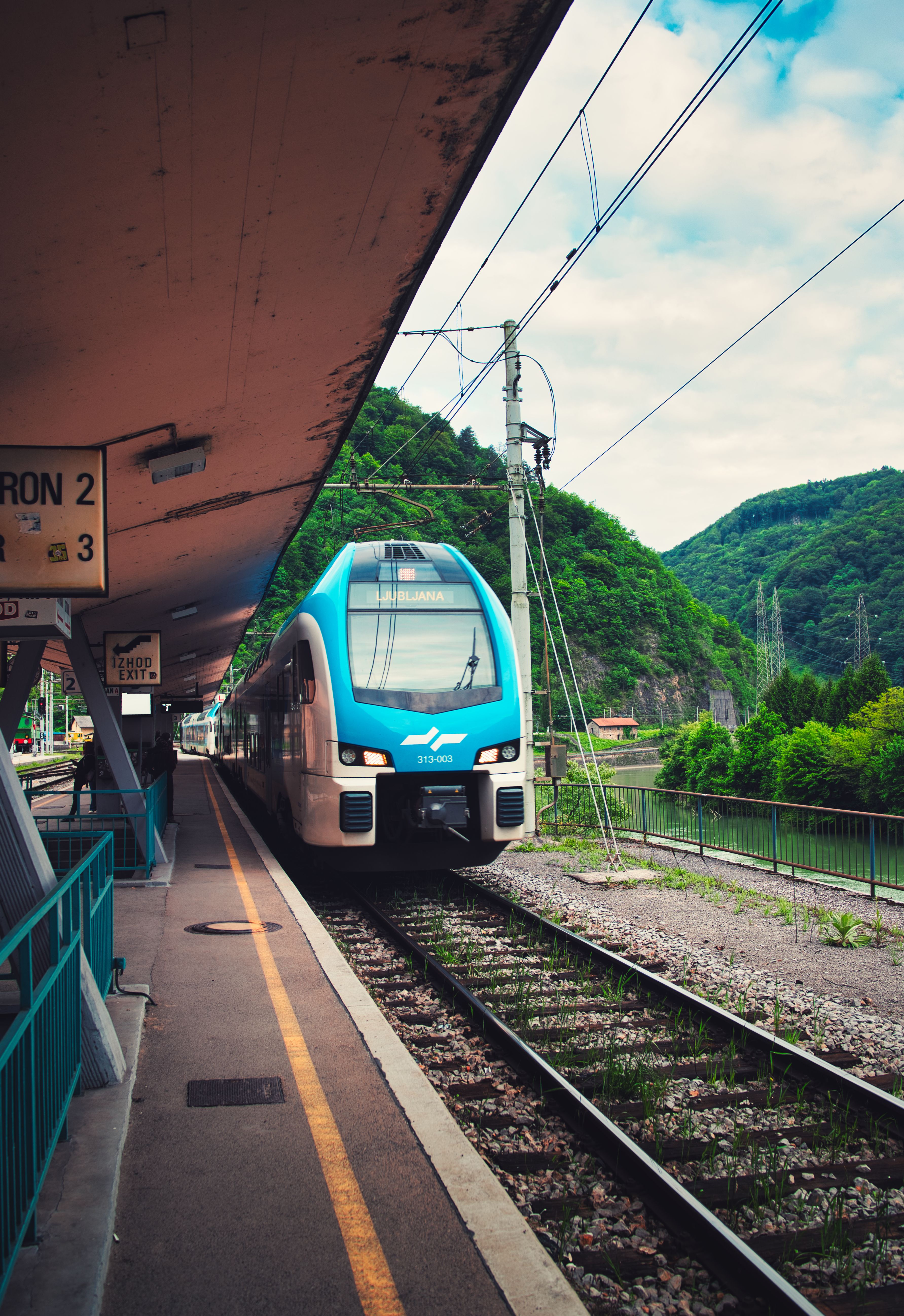Modern Commuter Train at Mountain Station · Free Stock Photo