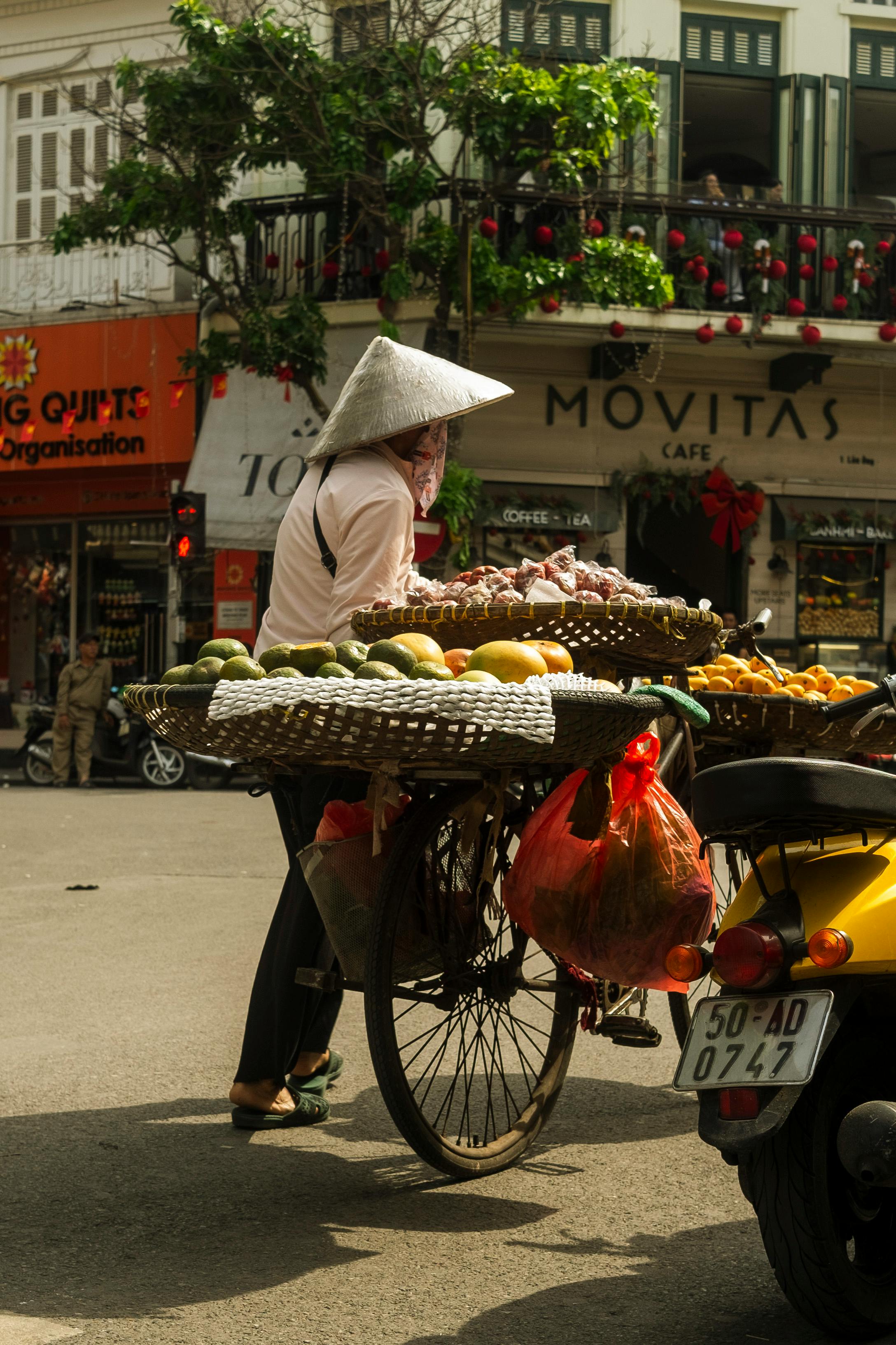 Traditional Street Vendor in Hanoi, Vietnam · Free Stock Photo