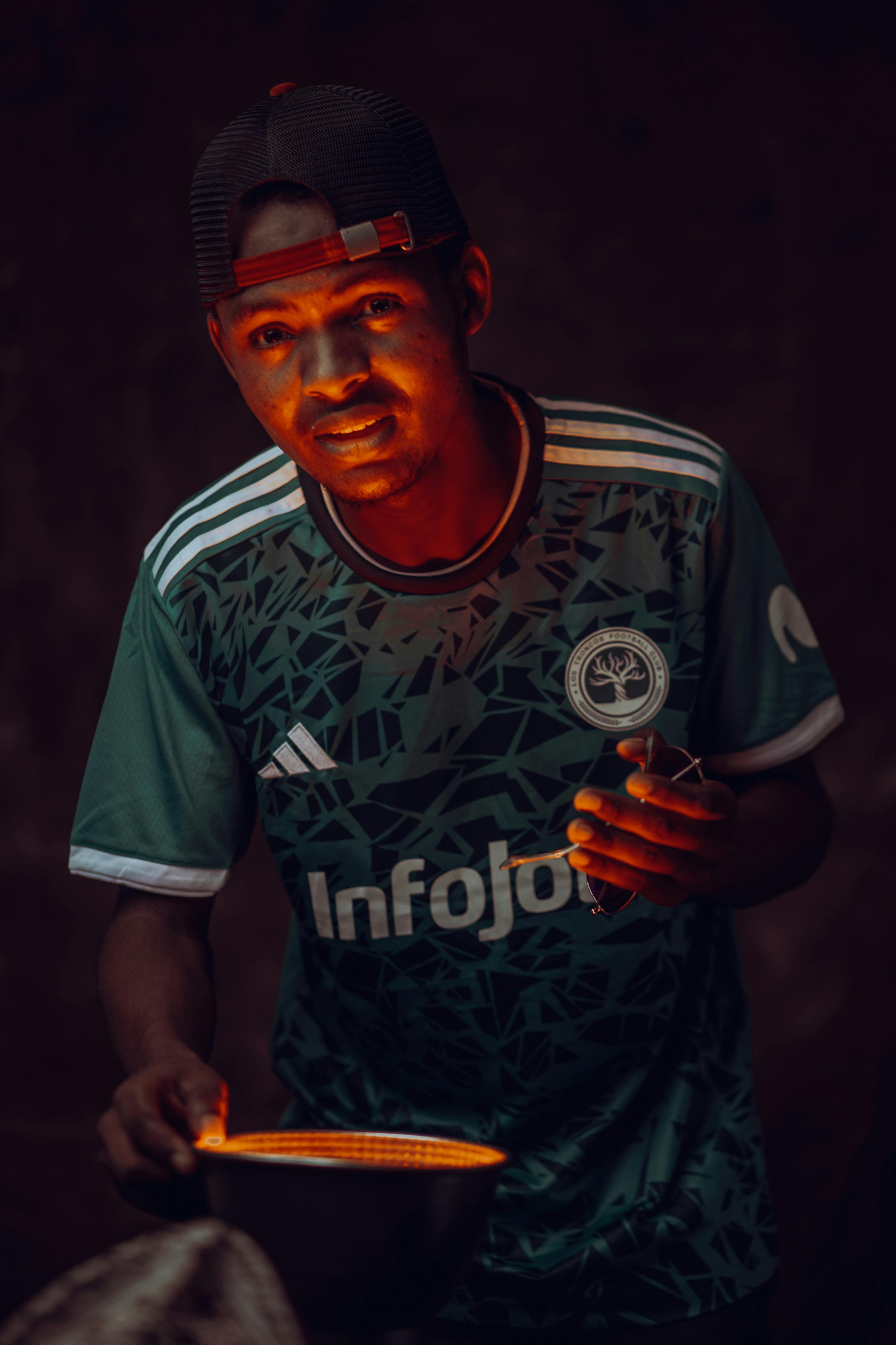 Portrait of Man with Warm Red Lighting · Free Stock Photo