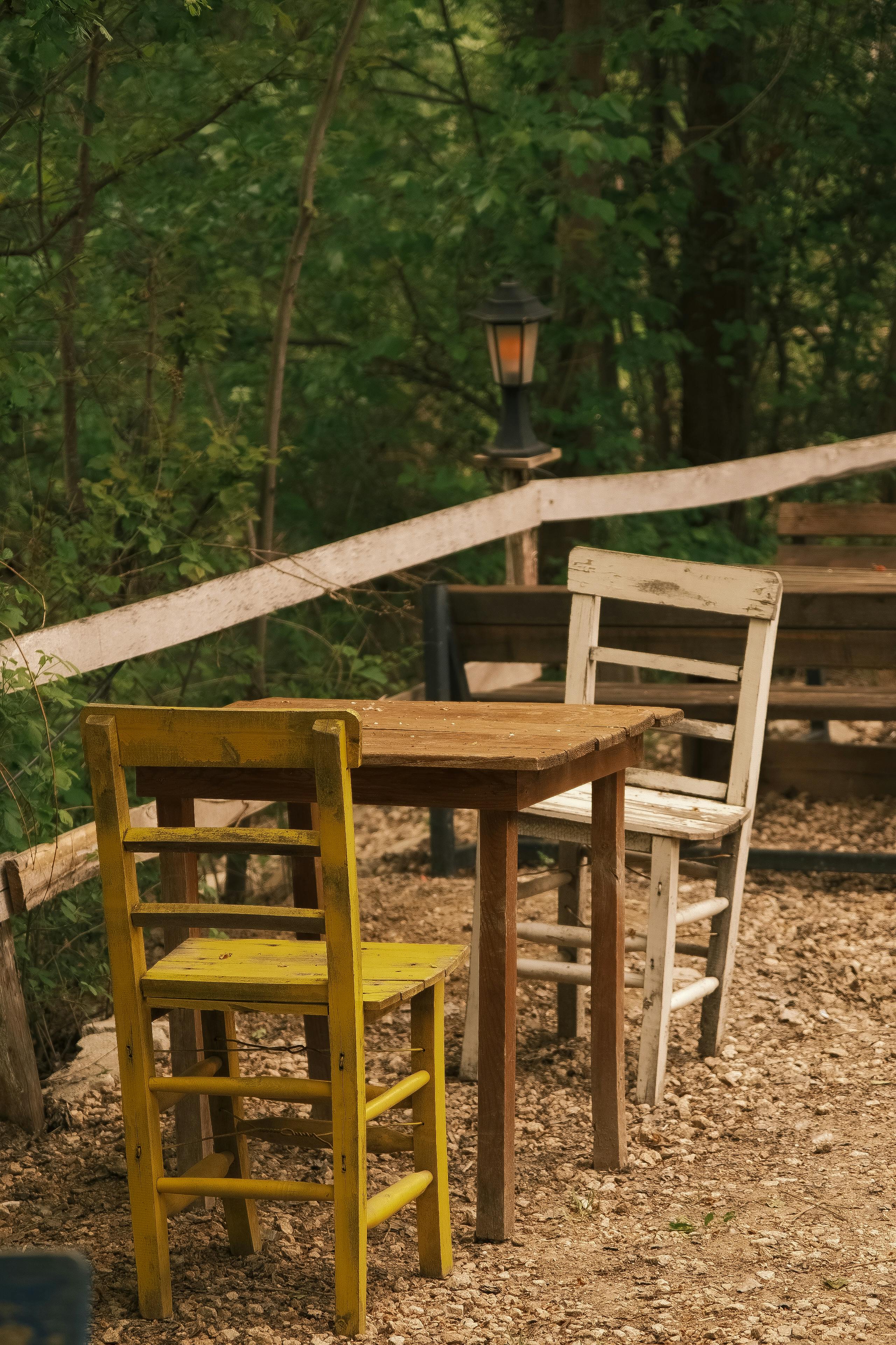 Rustic Outdoor Setting with Wooden Chairs · Free Stock Photo