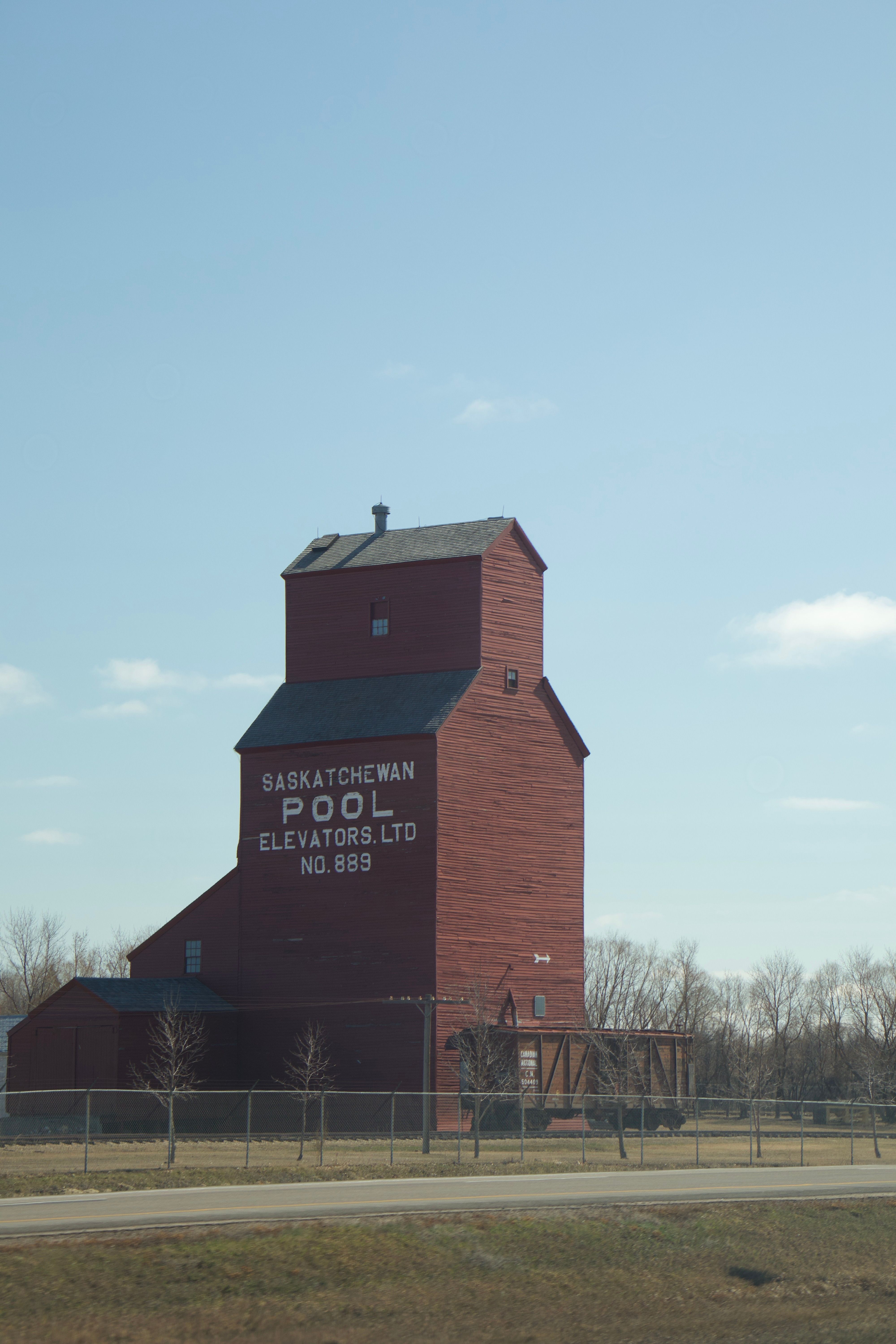 Historic Red Elevator in Saskatchewan Field · Free Stock Photo