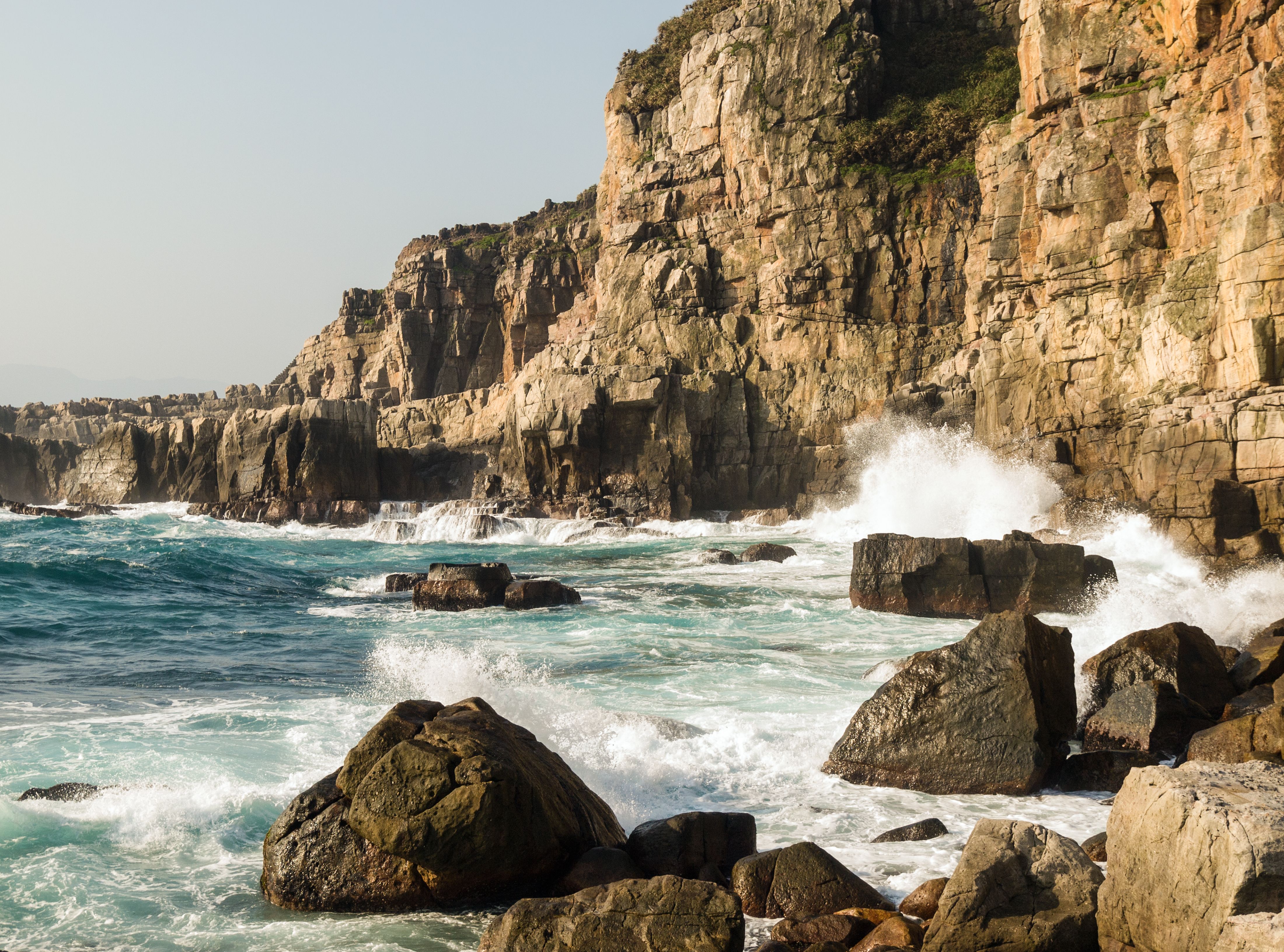 Rugged Coastline with Crashing Waves and Cliffs · Free Stock Photo
