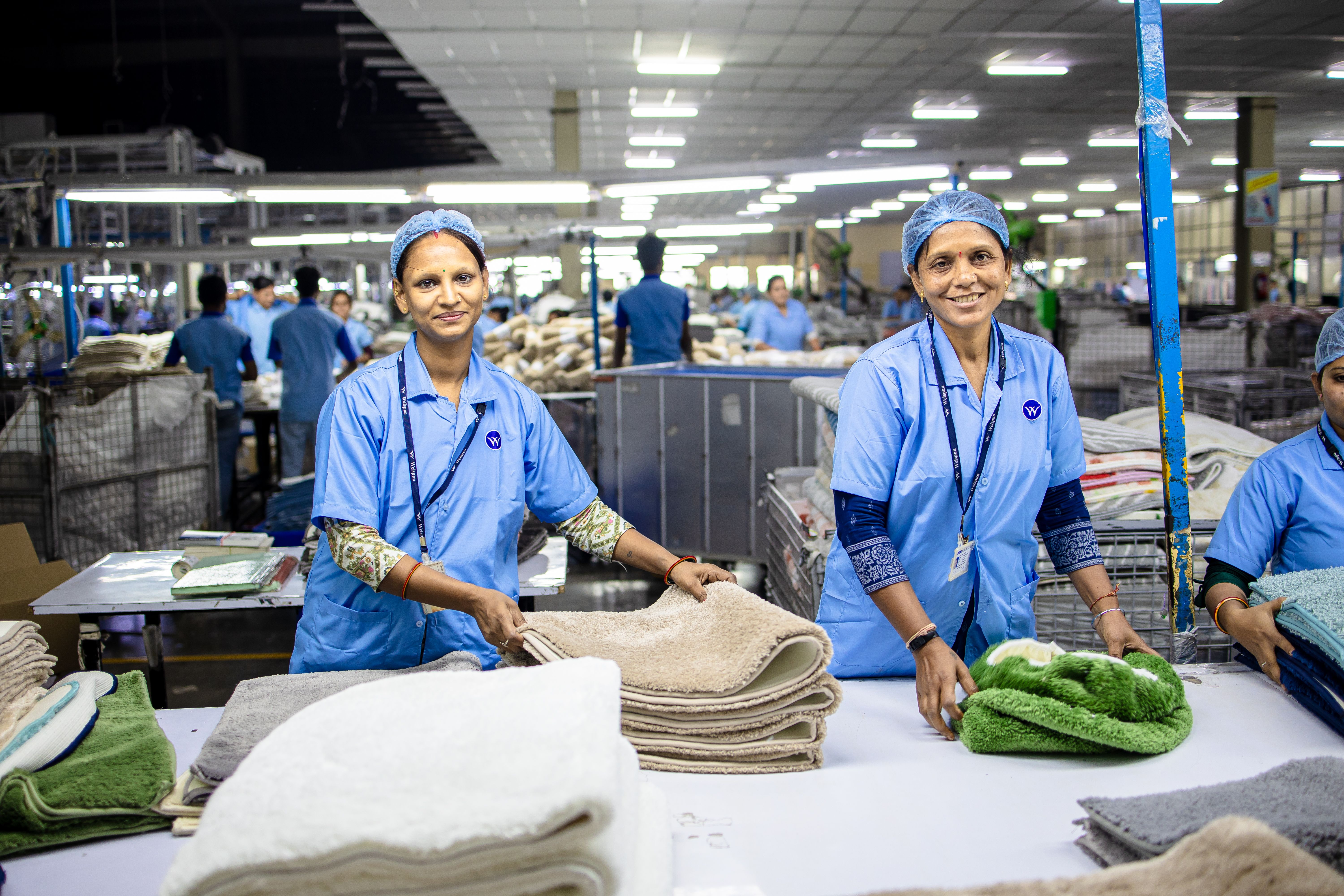 Textile Factory Workers Sorting Towels · Free Stock Photo
