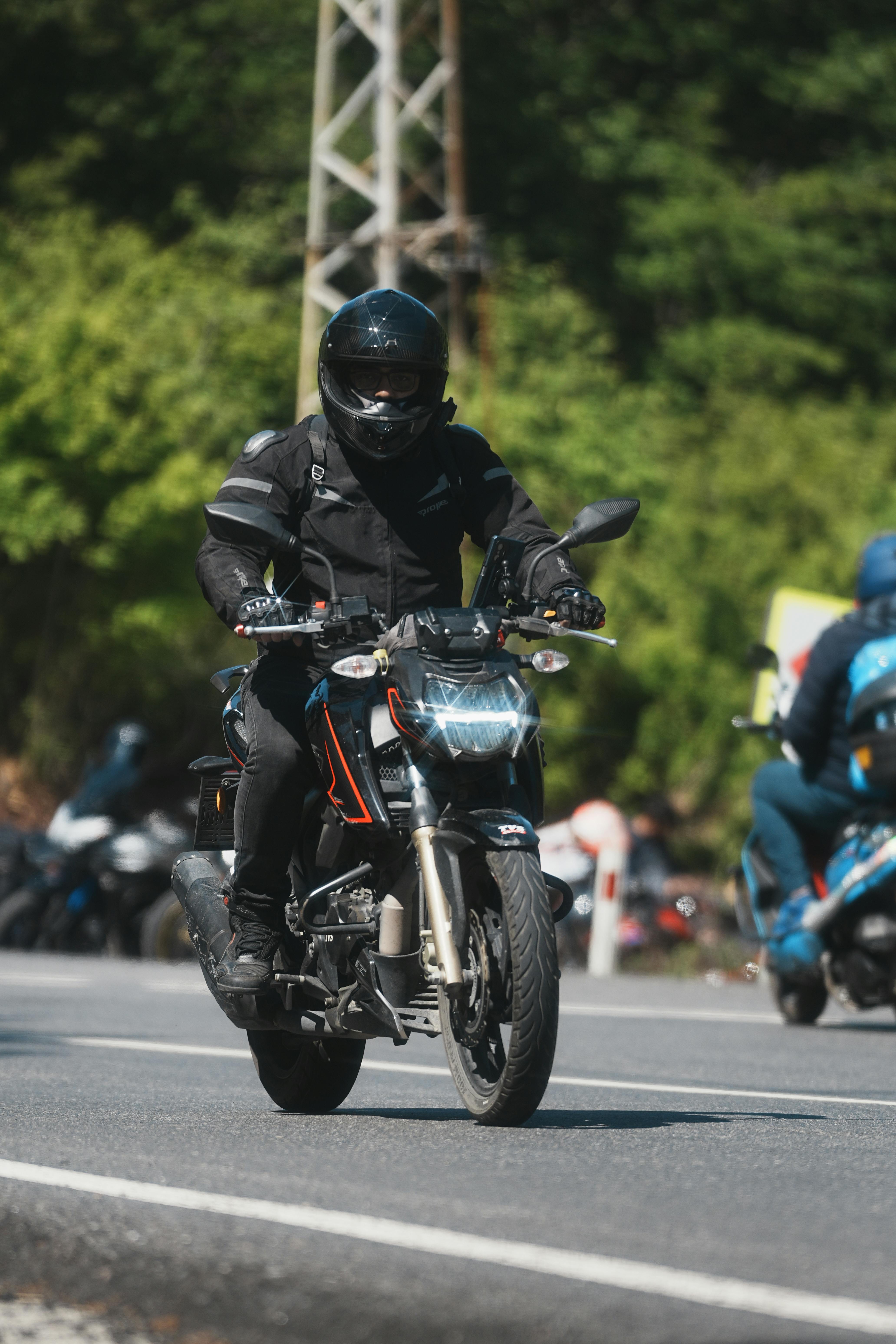 Black Backbone Motorcycle Near Man in Blue Shirt at Daytime · Free ...