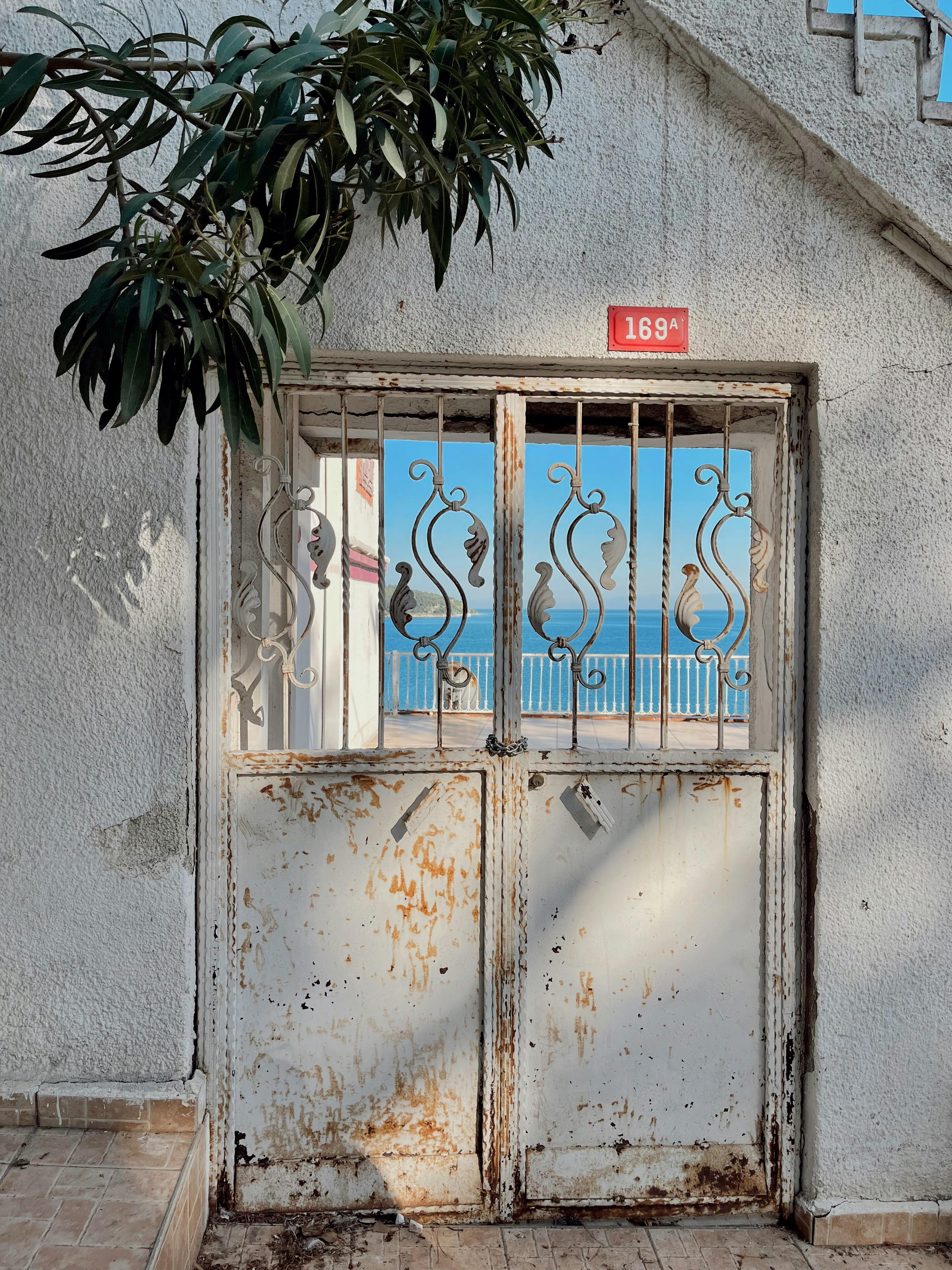 Rustic Metal Door with Ocean View · Free Stock Photo