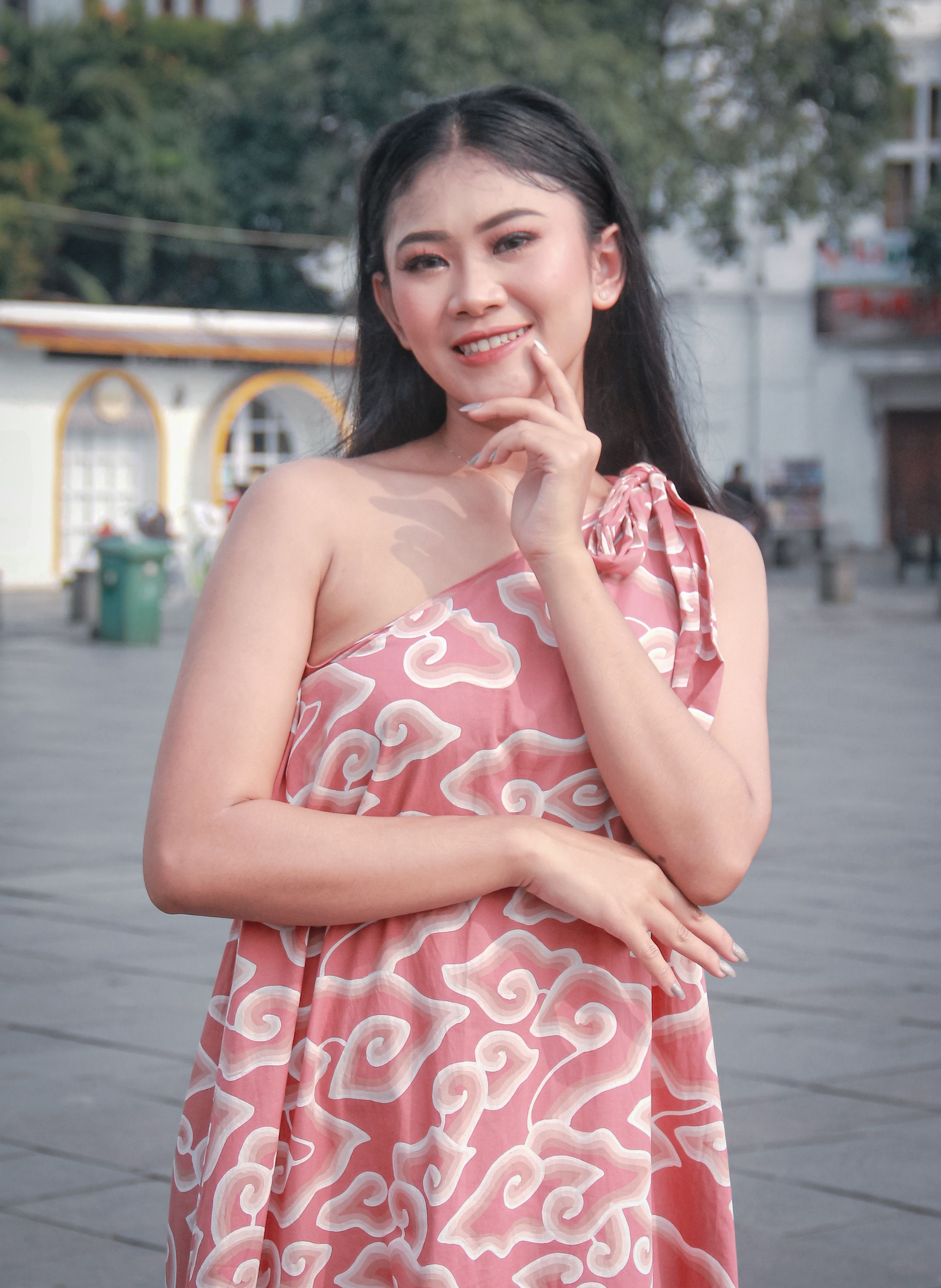 Portrait of Woman in Traditional Batik Dress Outdoors · Free Stock Photo