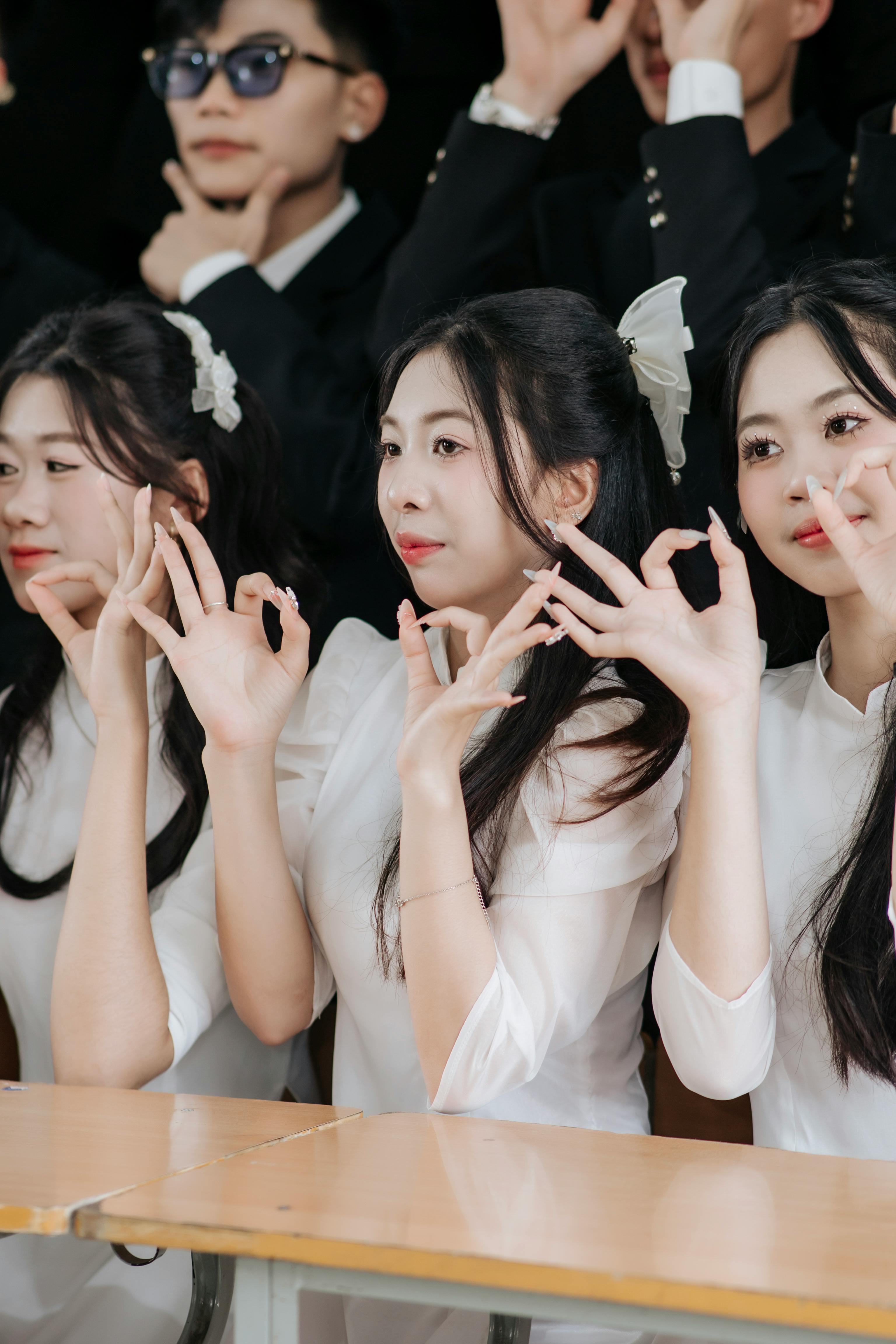 Group of Young People Making Heart Hand Gesture · Free Stock Photo