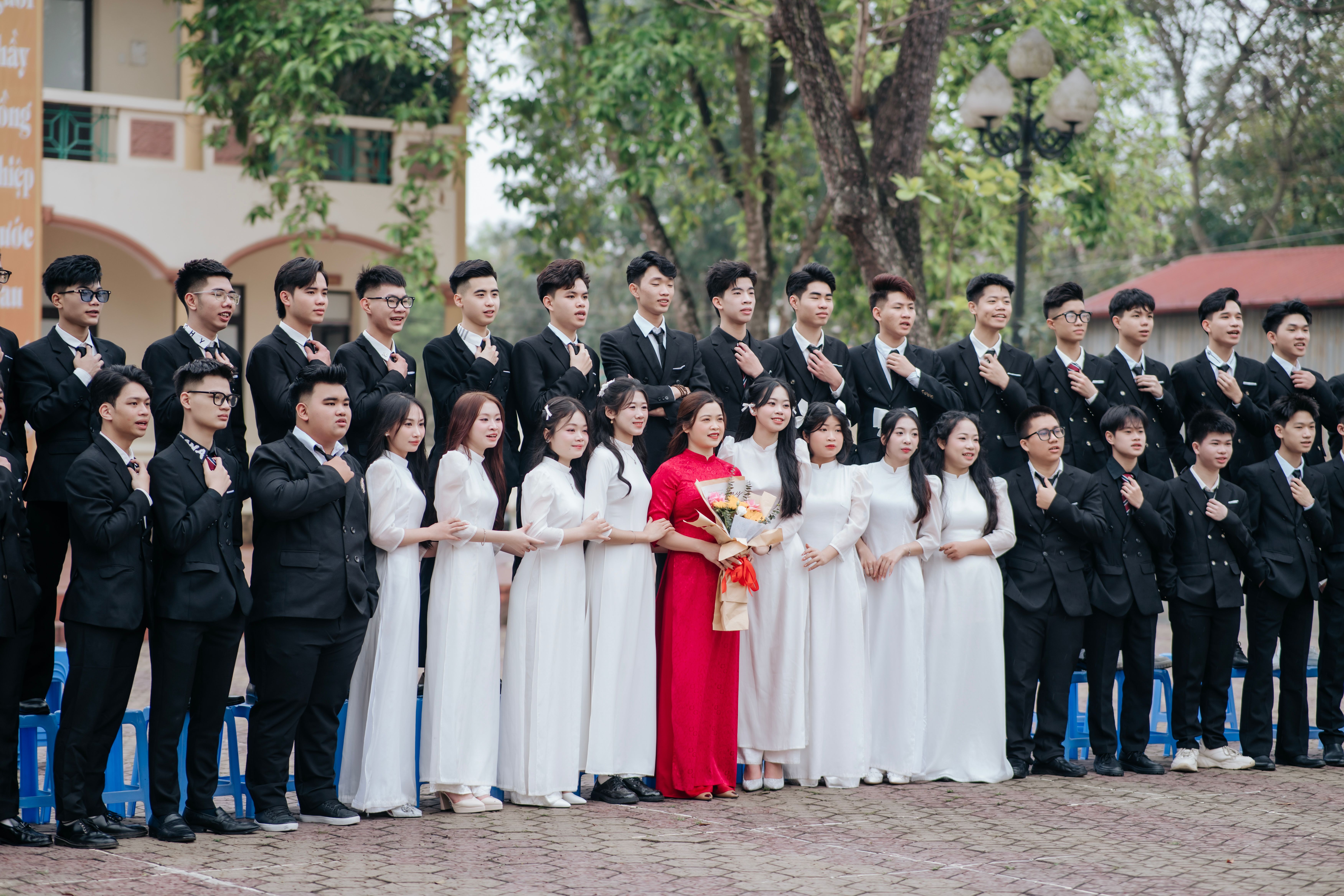 Graduation Ceremony with Happy Graduates Outdoors · Free Stock Photo