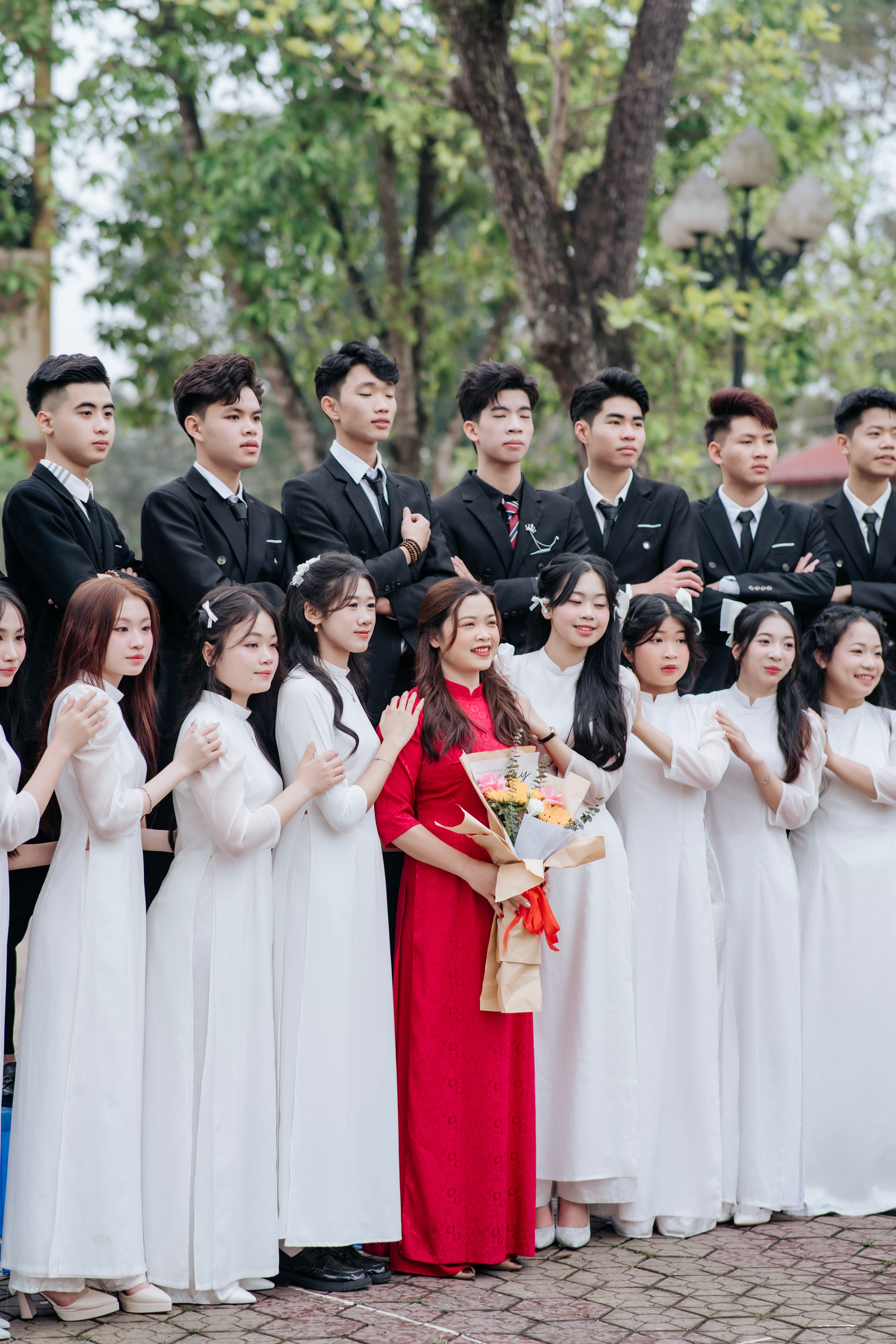 Group of Students in Traditional Attire Celebrating · Free Stock Photo