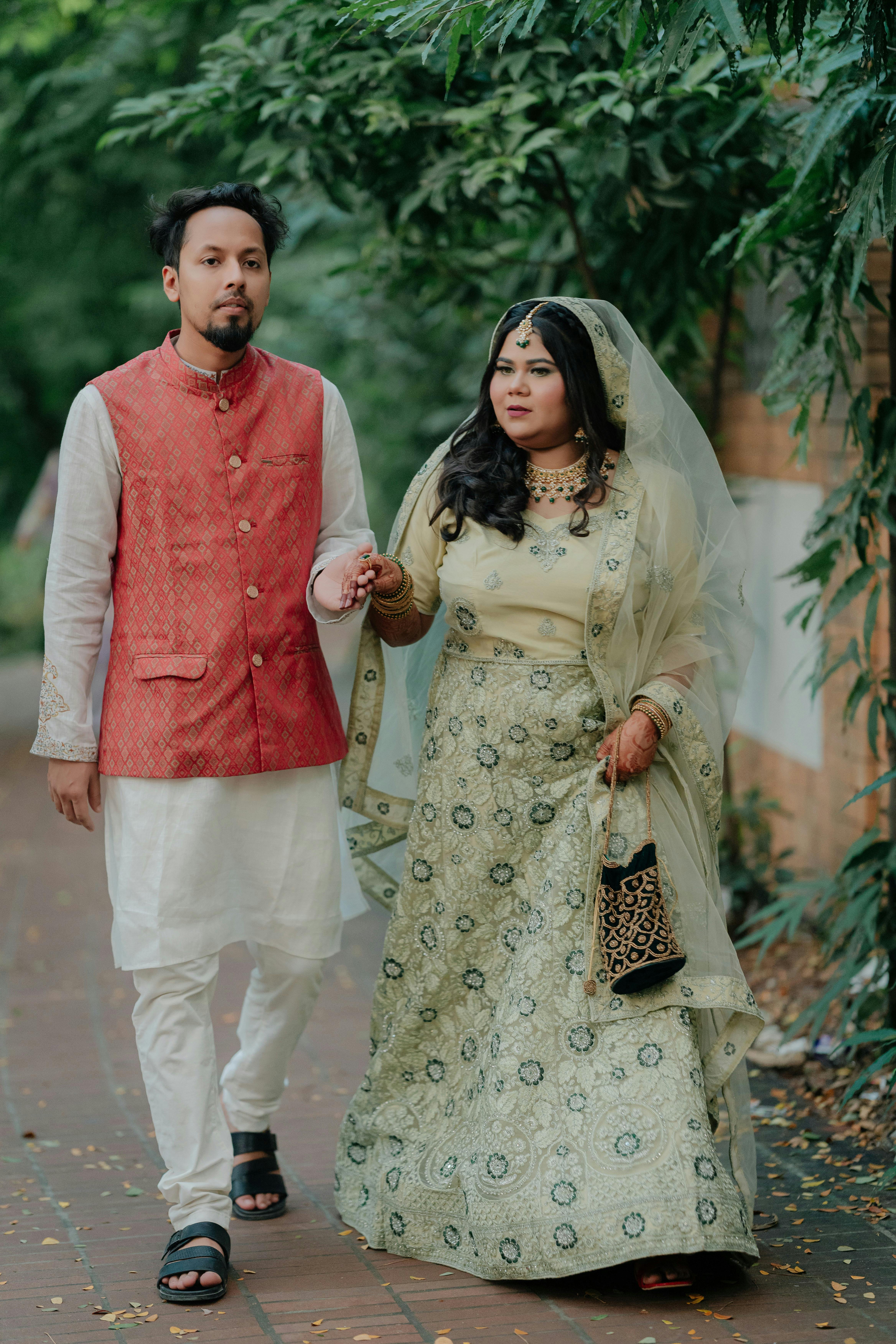 Elegant Couple in Traditional South Asian Attire · Free Stock Photo