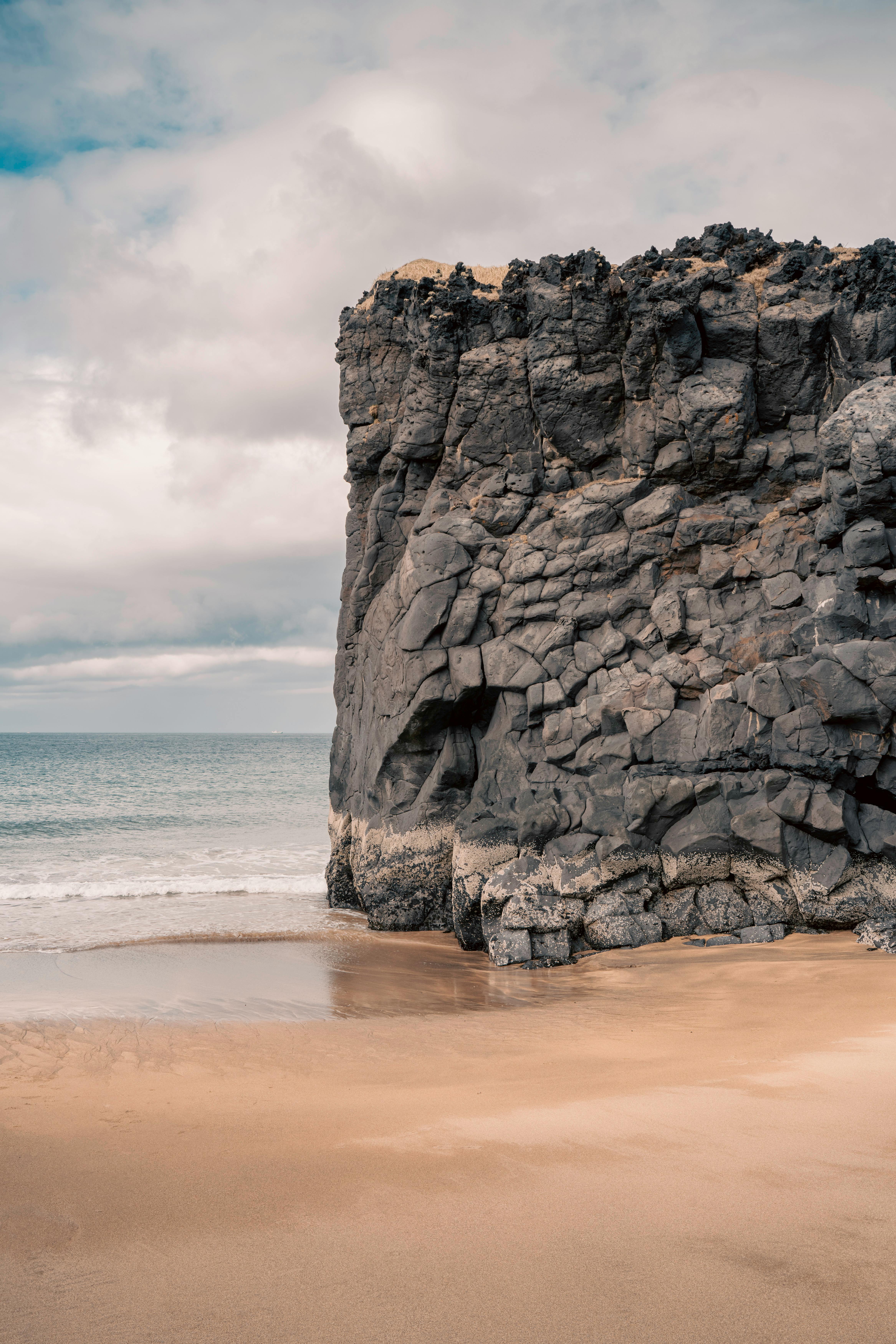 Majestic Basalt Cliffs along Icelandic Coastline · Free Stock Photo