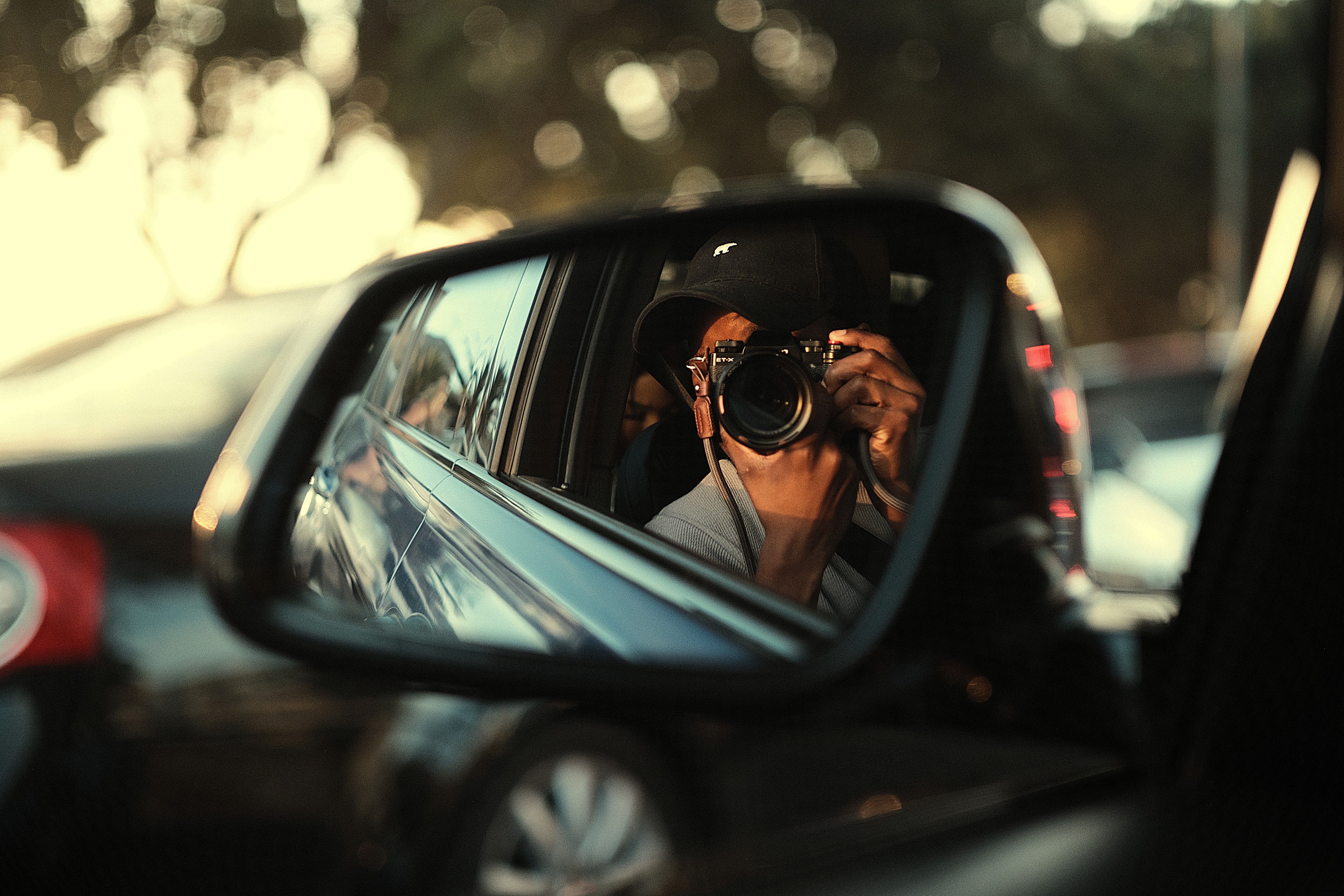 Photographer Captures Reflection in Car Mirror · Free Stock Photo