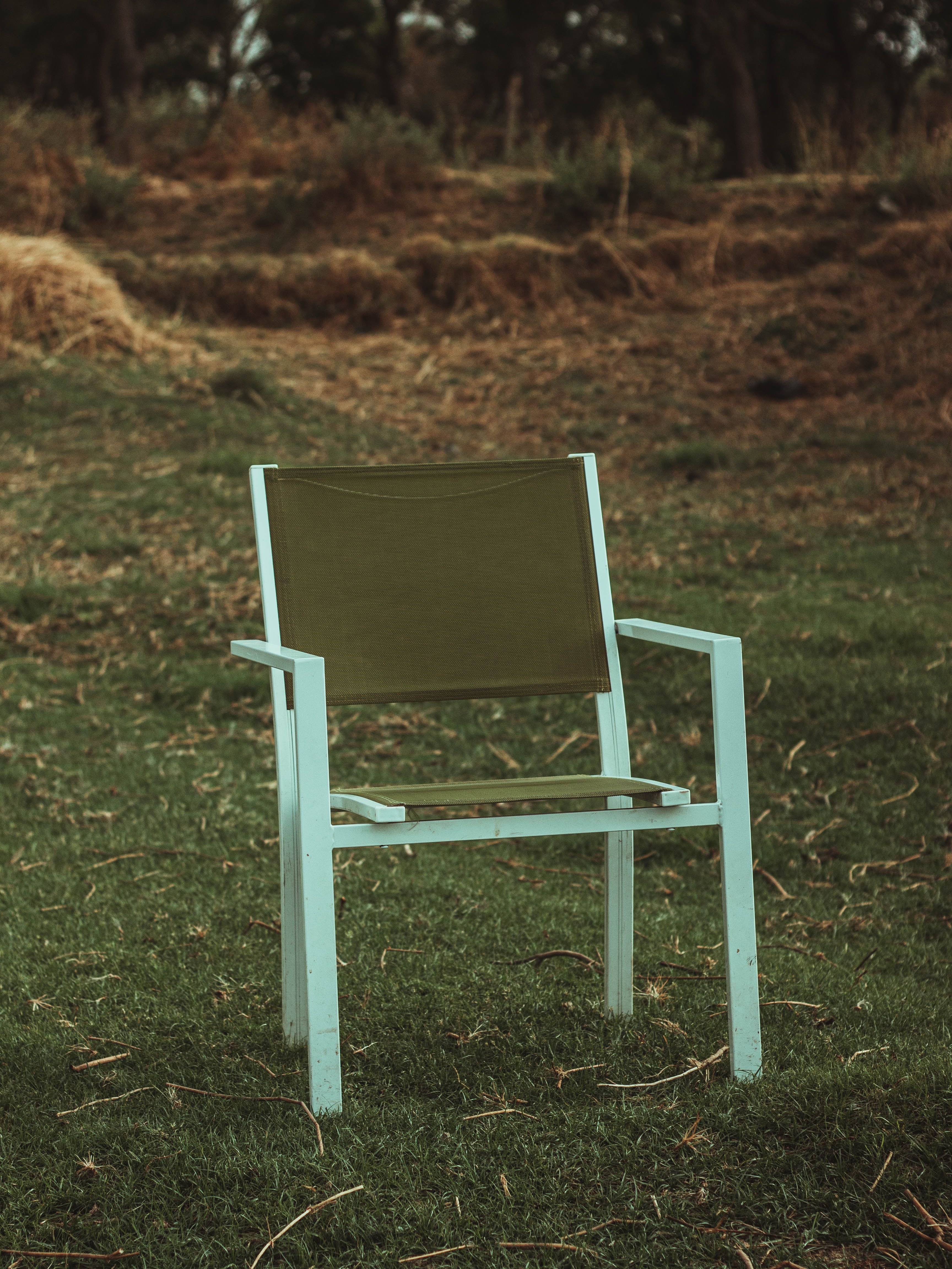 Minimalist Outdoor Chair on Grass Field · Free Stock Photo
