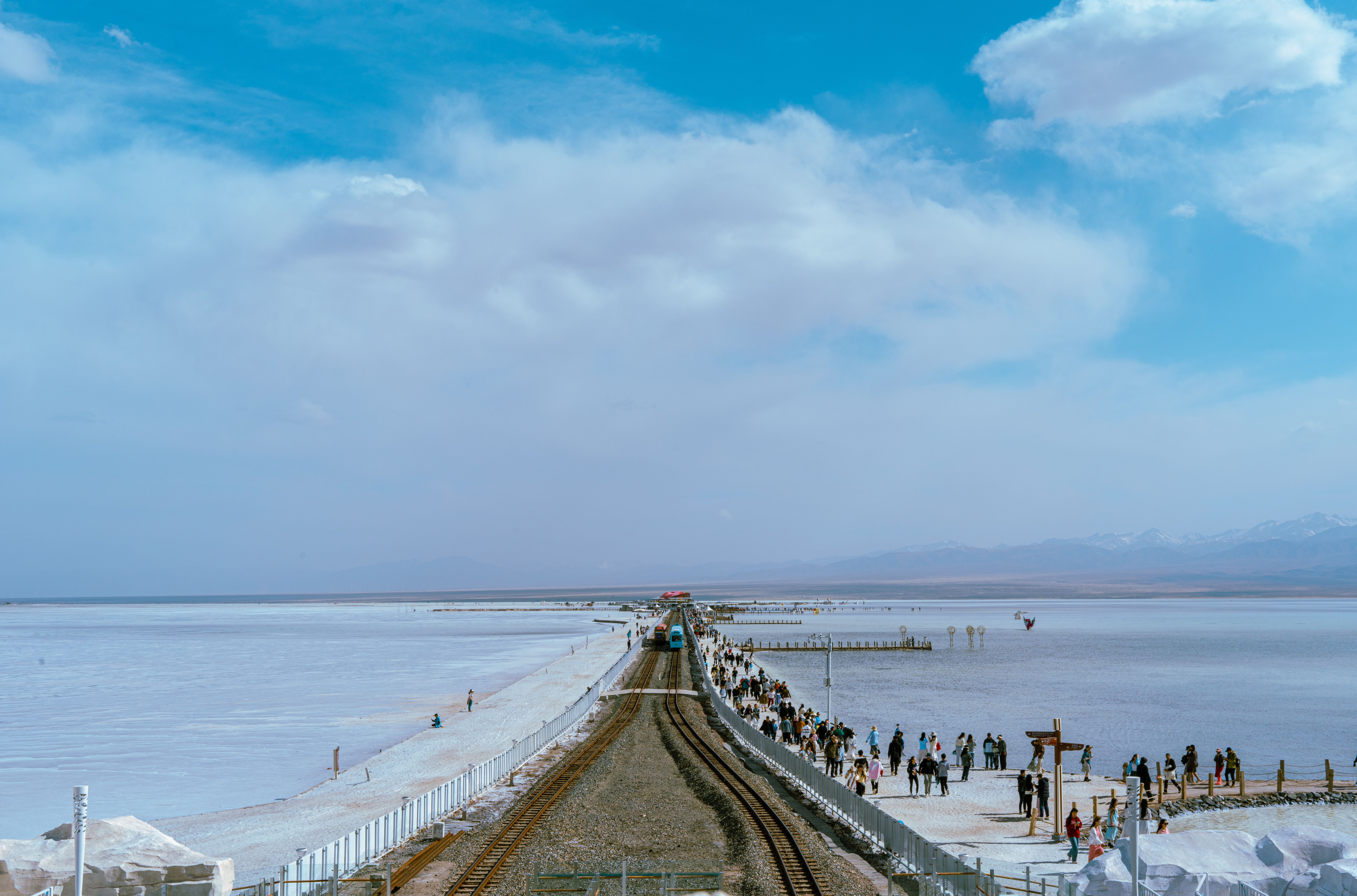 Scenic Railway Track Along a Salt Lake · Free Stock Photo