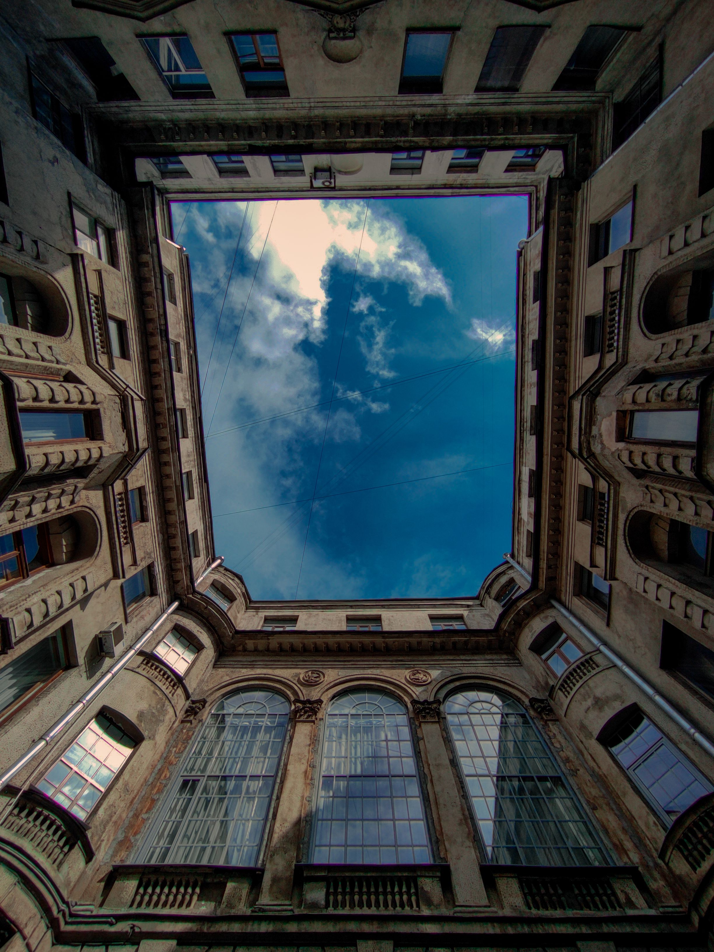 Dramatic View Through Historical Building Courtyard · Free Stock Photo