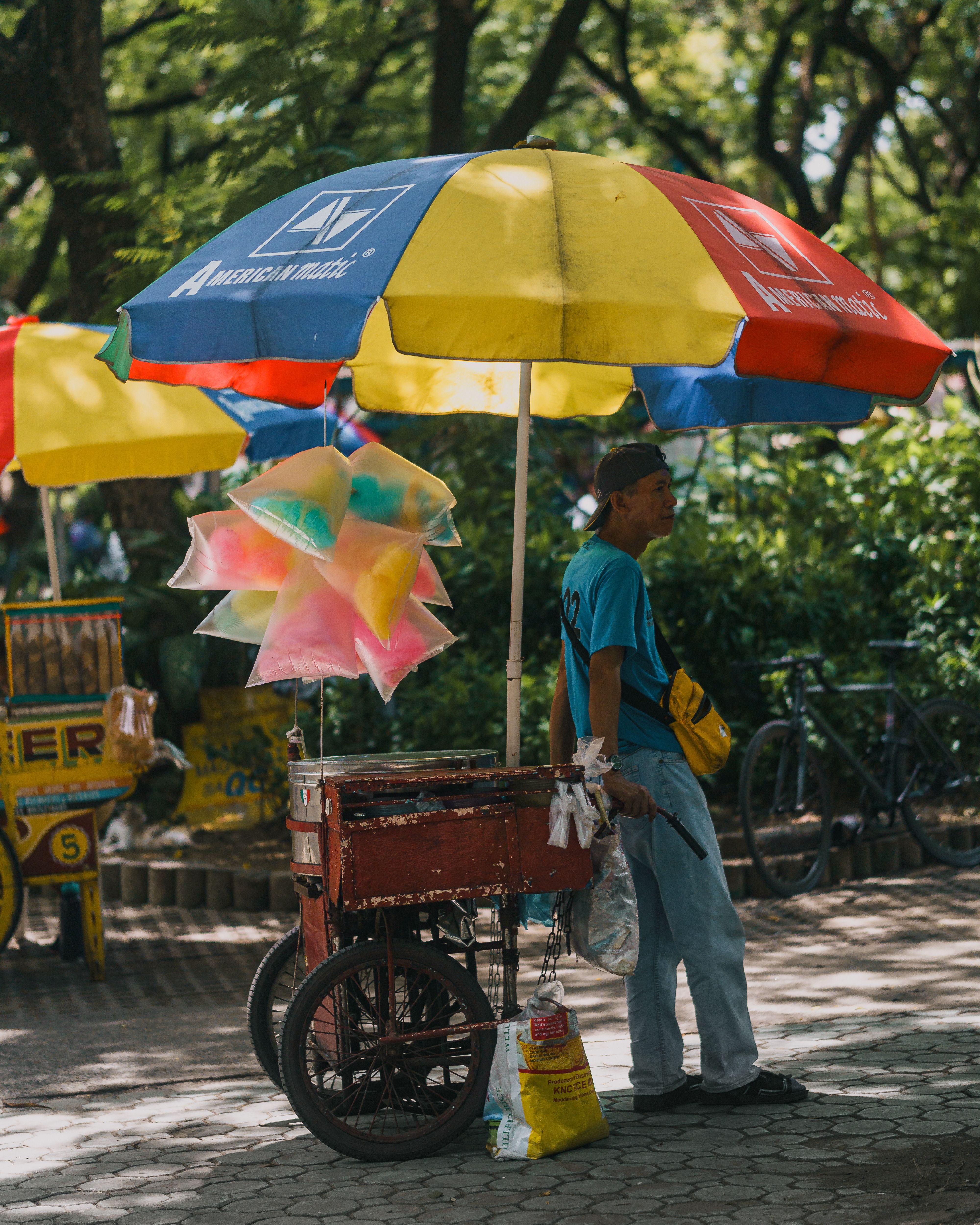 Street Vendor Selling Cotton Candy in Manila · Free Stock Photo