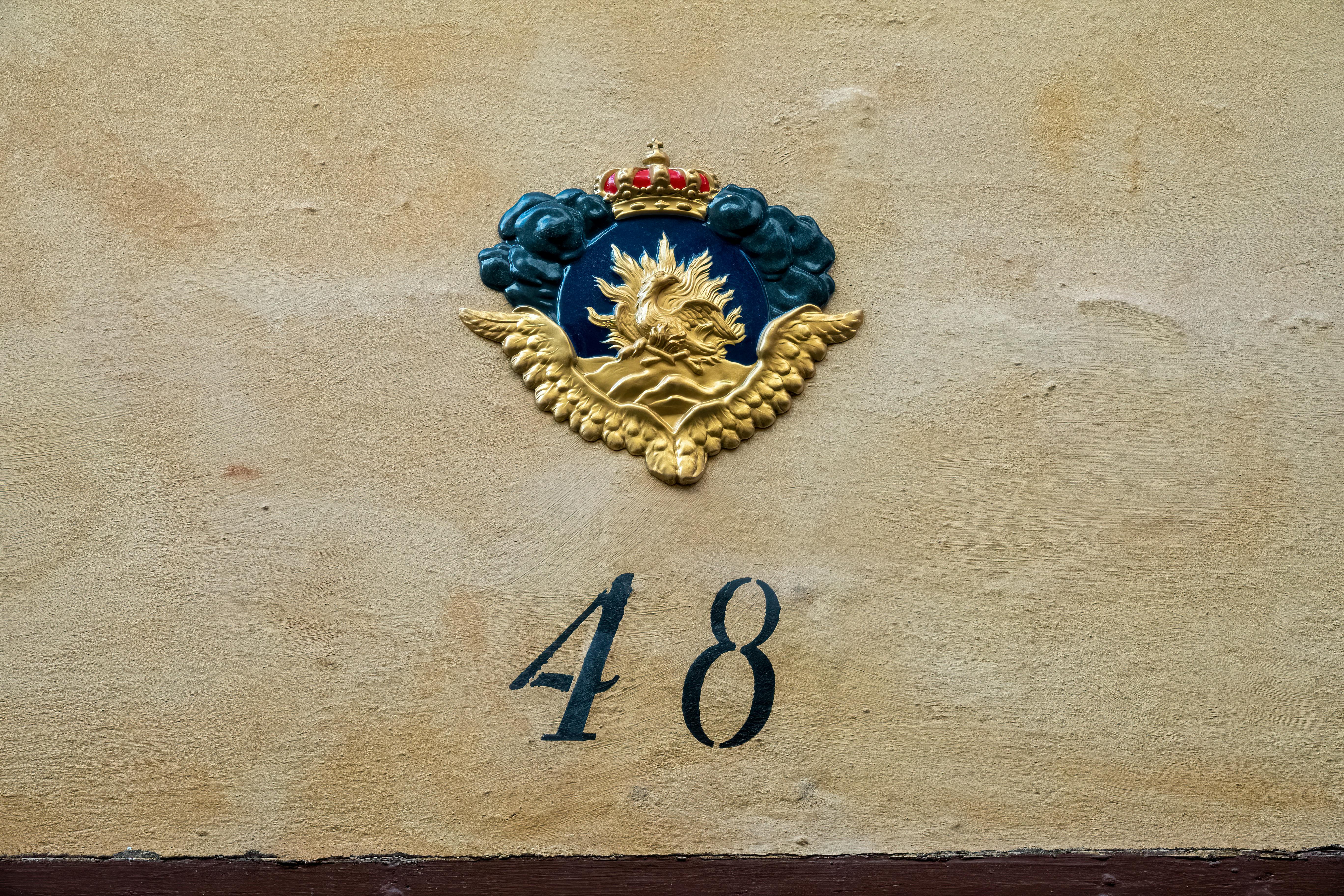Royal crest detail on historic Stockholm building · Free Stock Photo