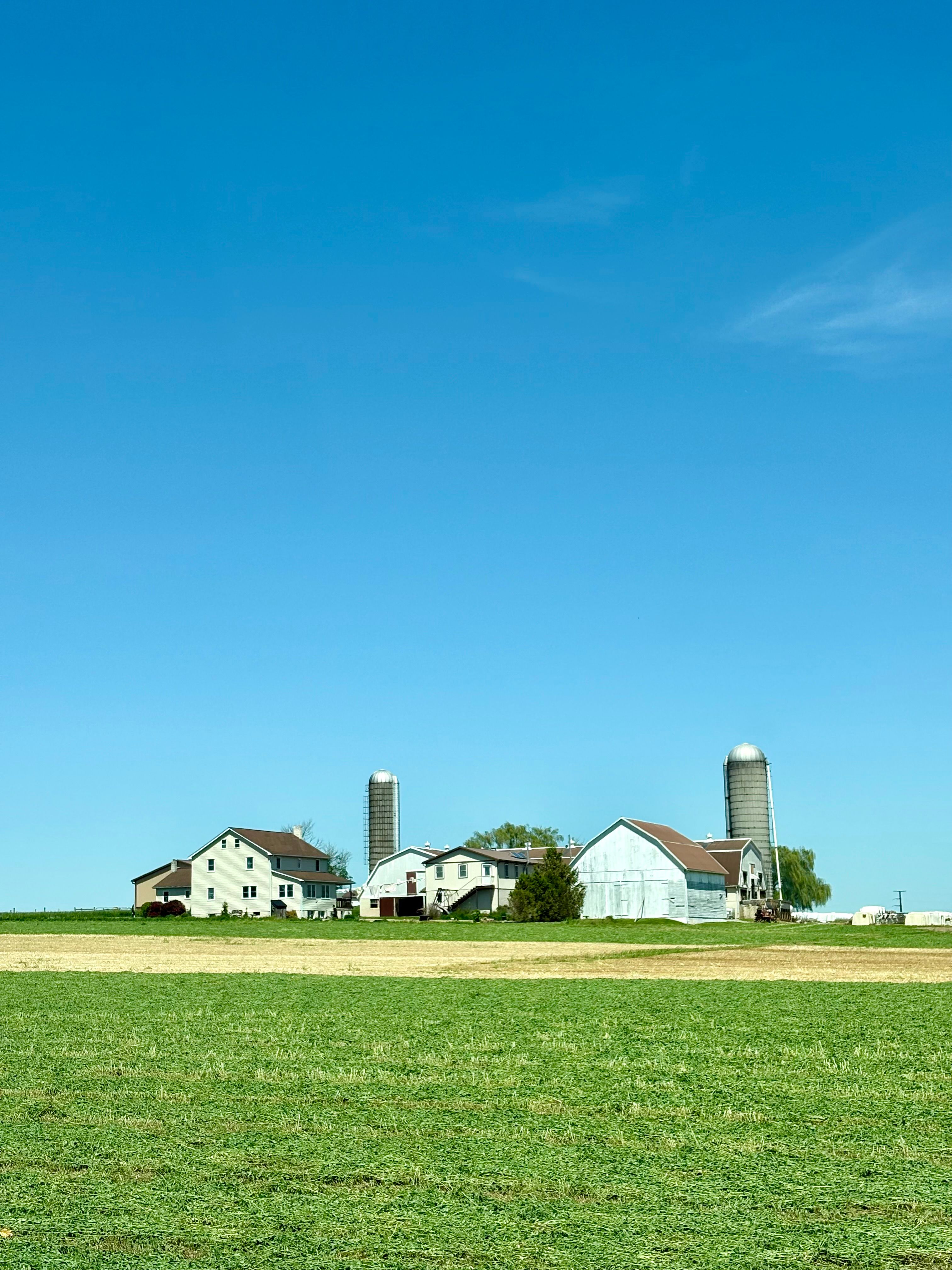 Idyllic Countryside Farm under Clear Blue Sky · Free Stock Photo