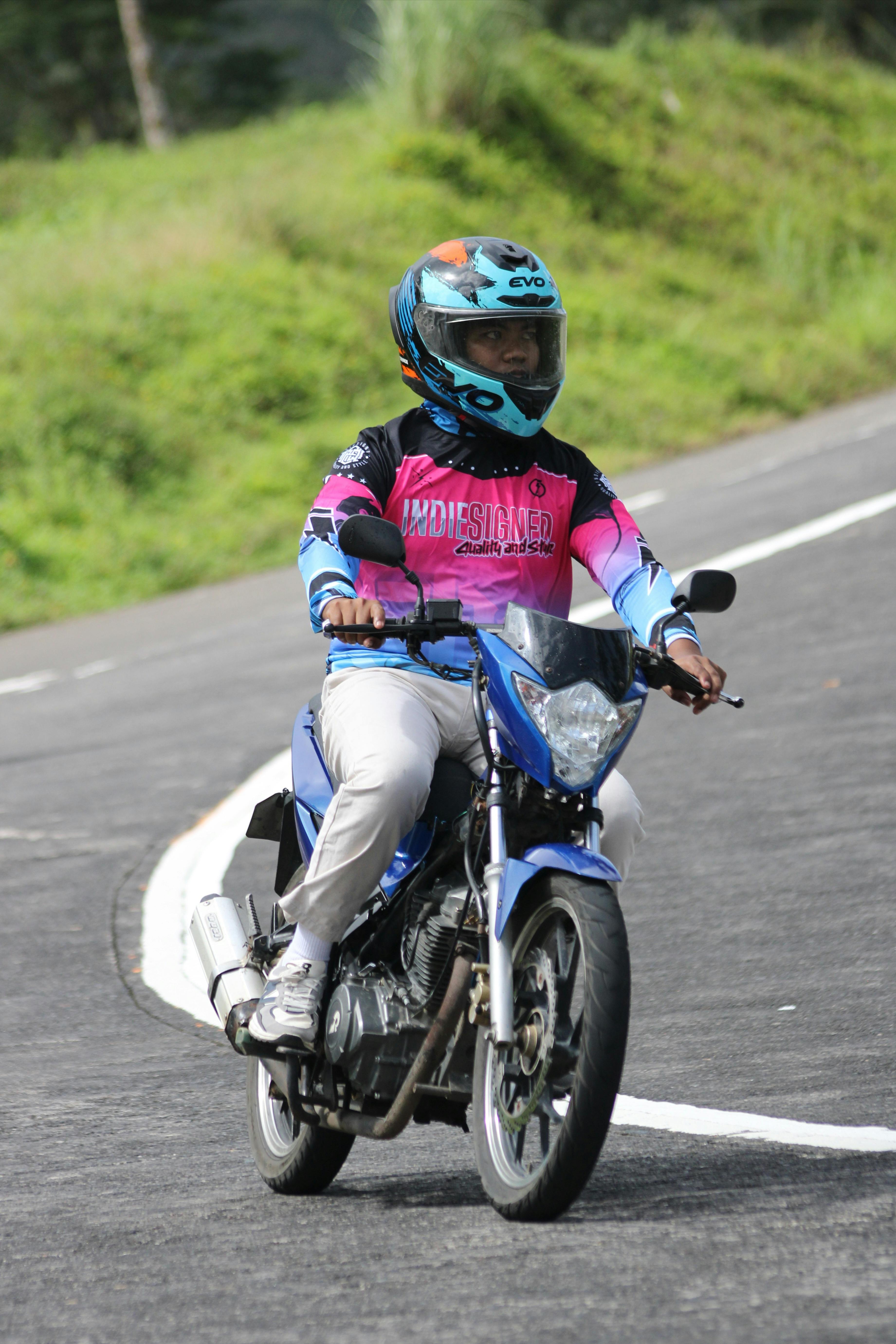 Motorcyclist Riding on Bicol Highway, Philippines · Free Stock Photo