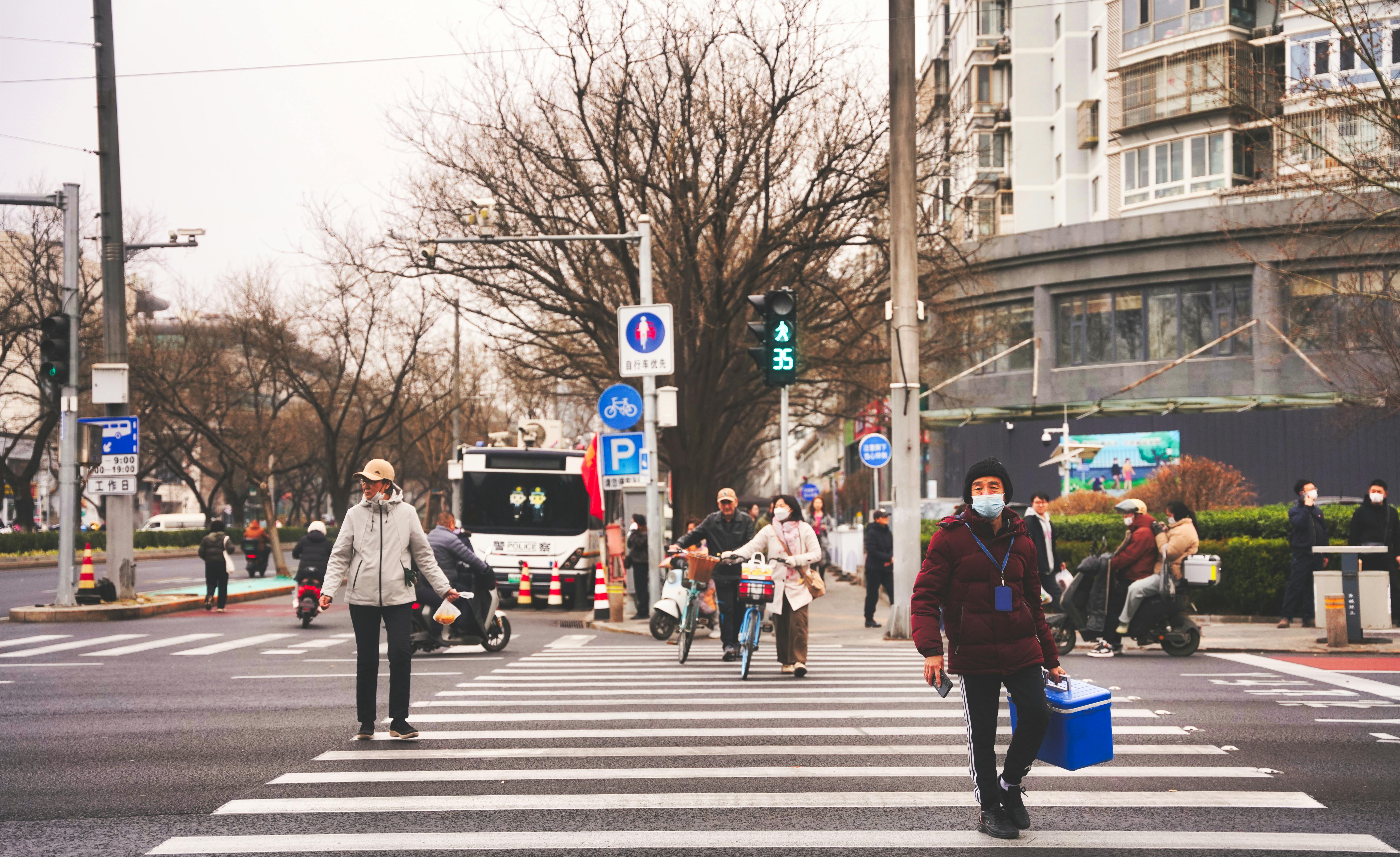 Busy Beijing Intersection with Pedestrians Crossing · Free Stock Photo