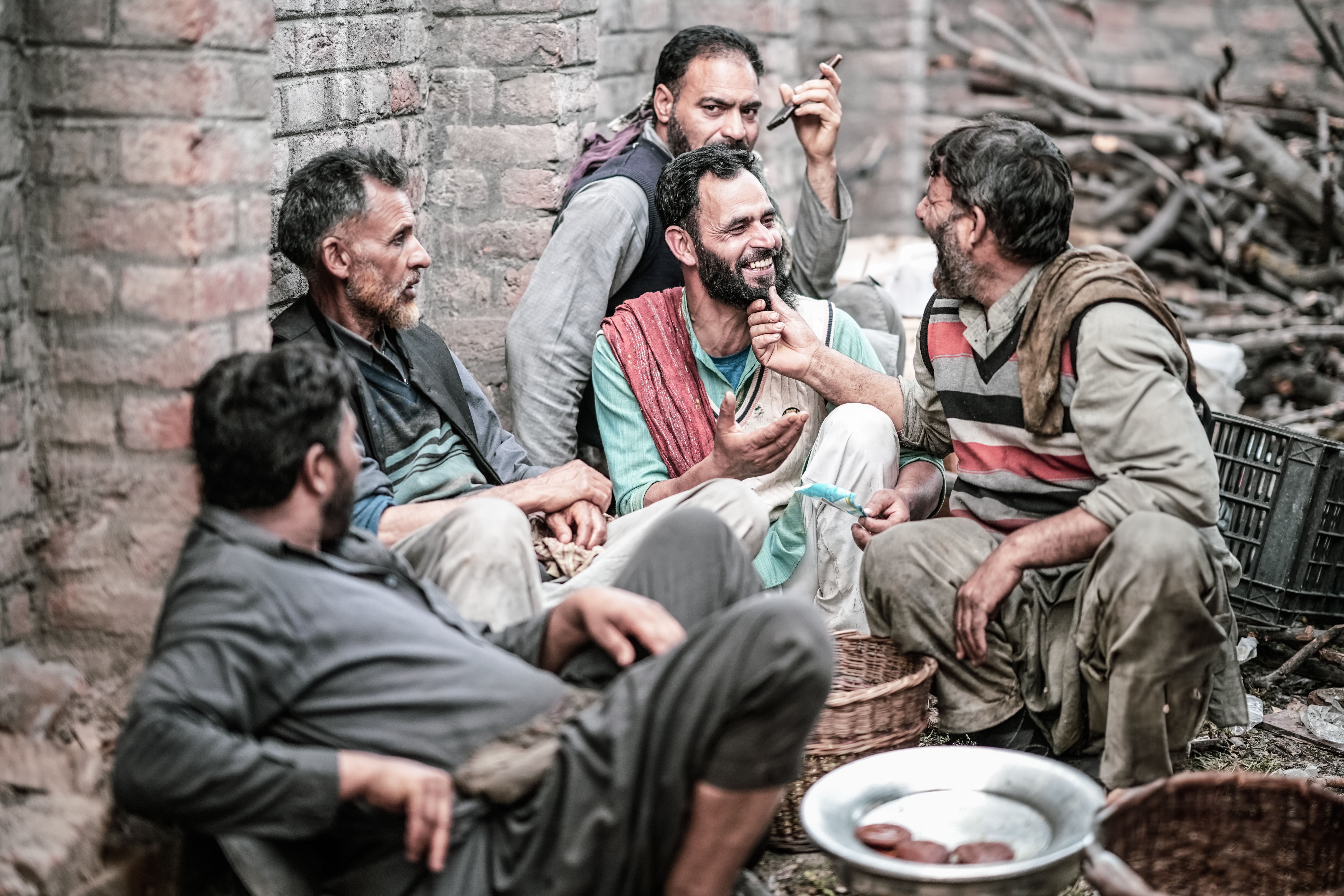 Group of Men Enjoying Casual Outdoor Gathering · Free Stock Photo