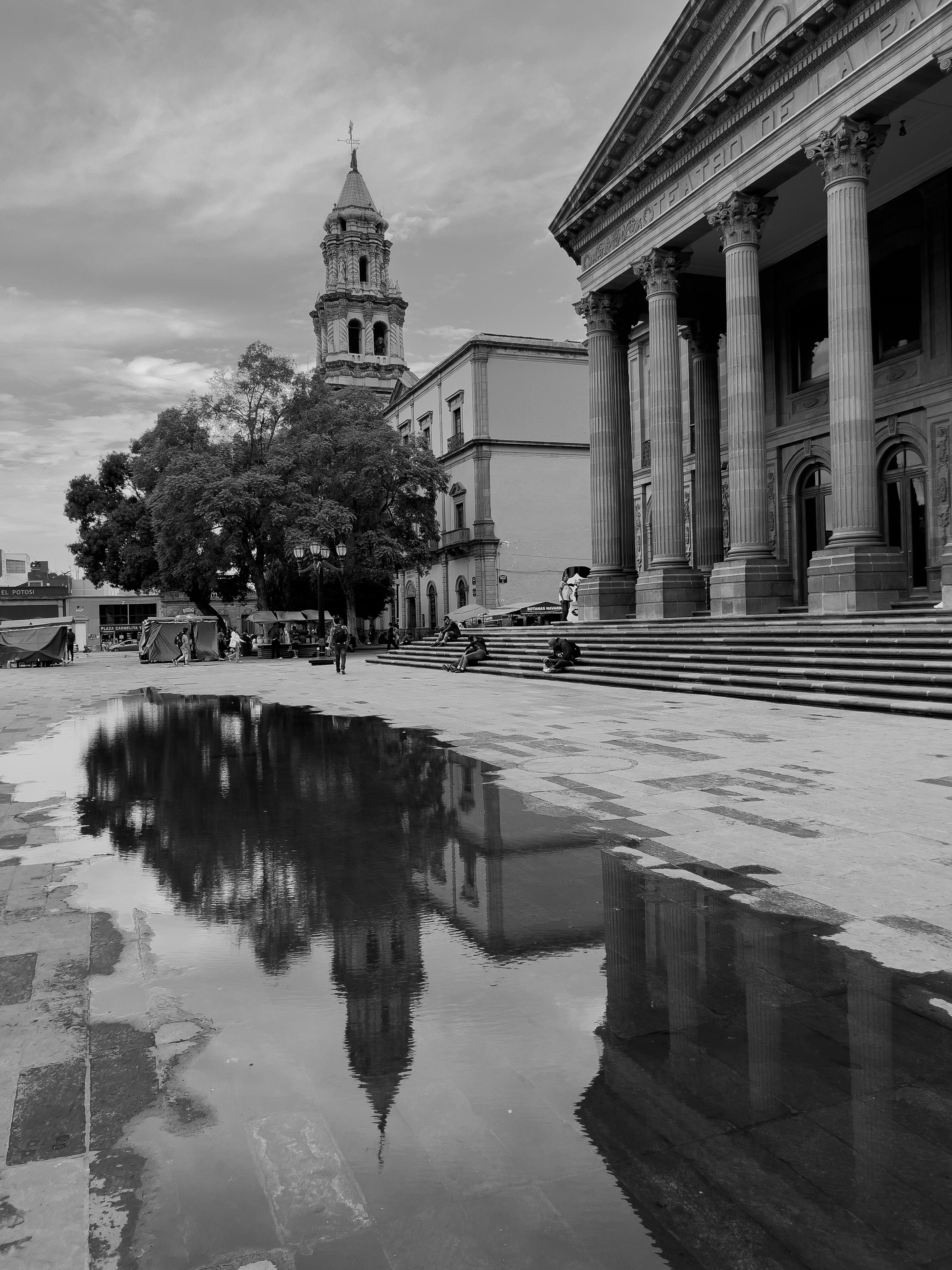 Colonial Architecture Reflected in Rain Puddle · Free Stock Photo