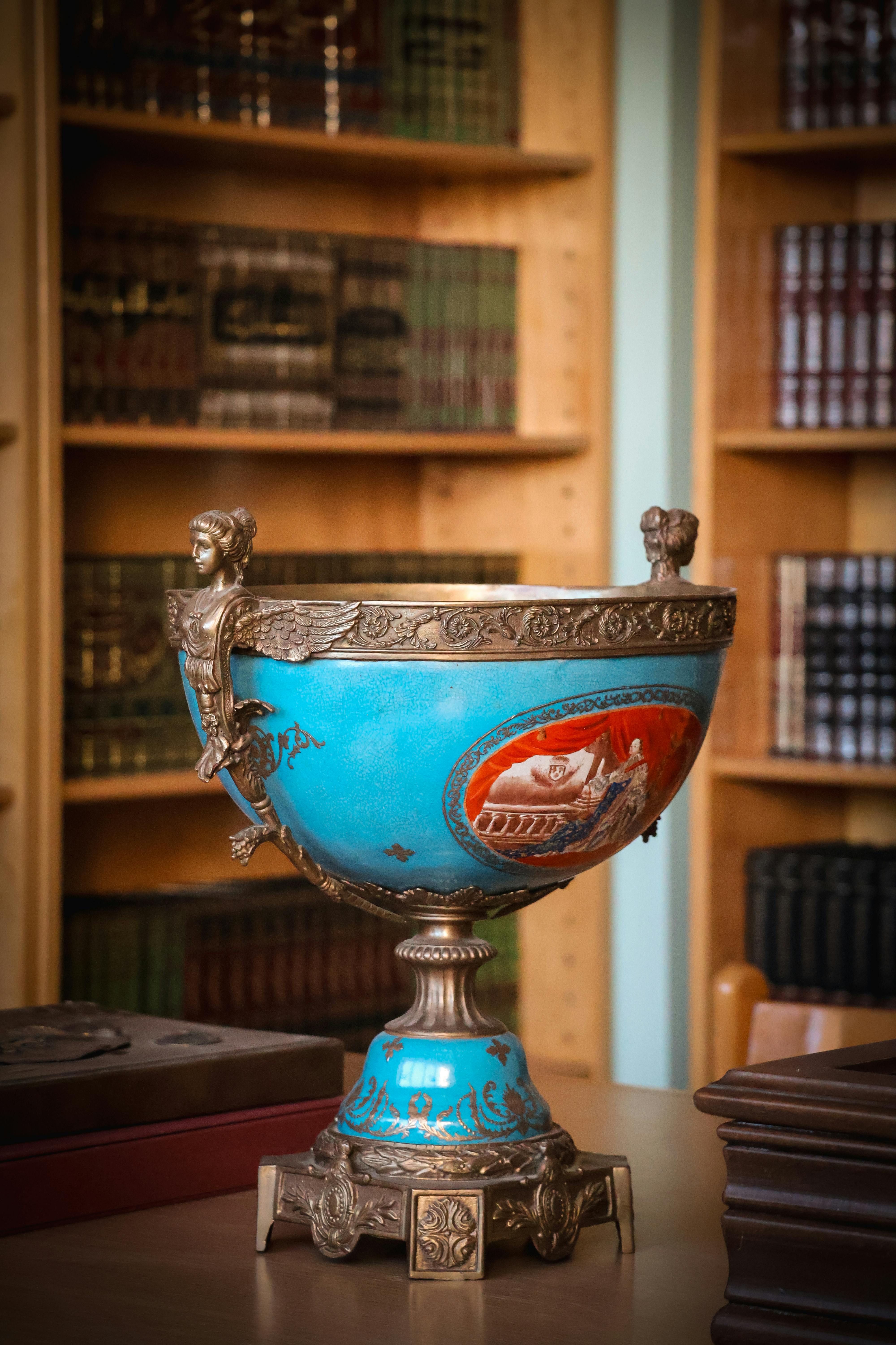 Elegant Decorative Trophy in Classic Library Setting · Free Stock Photo