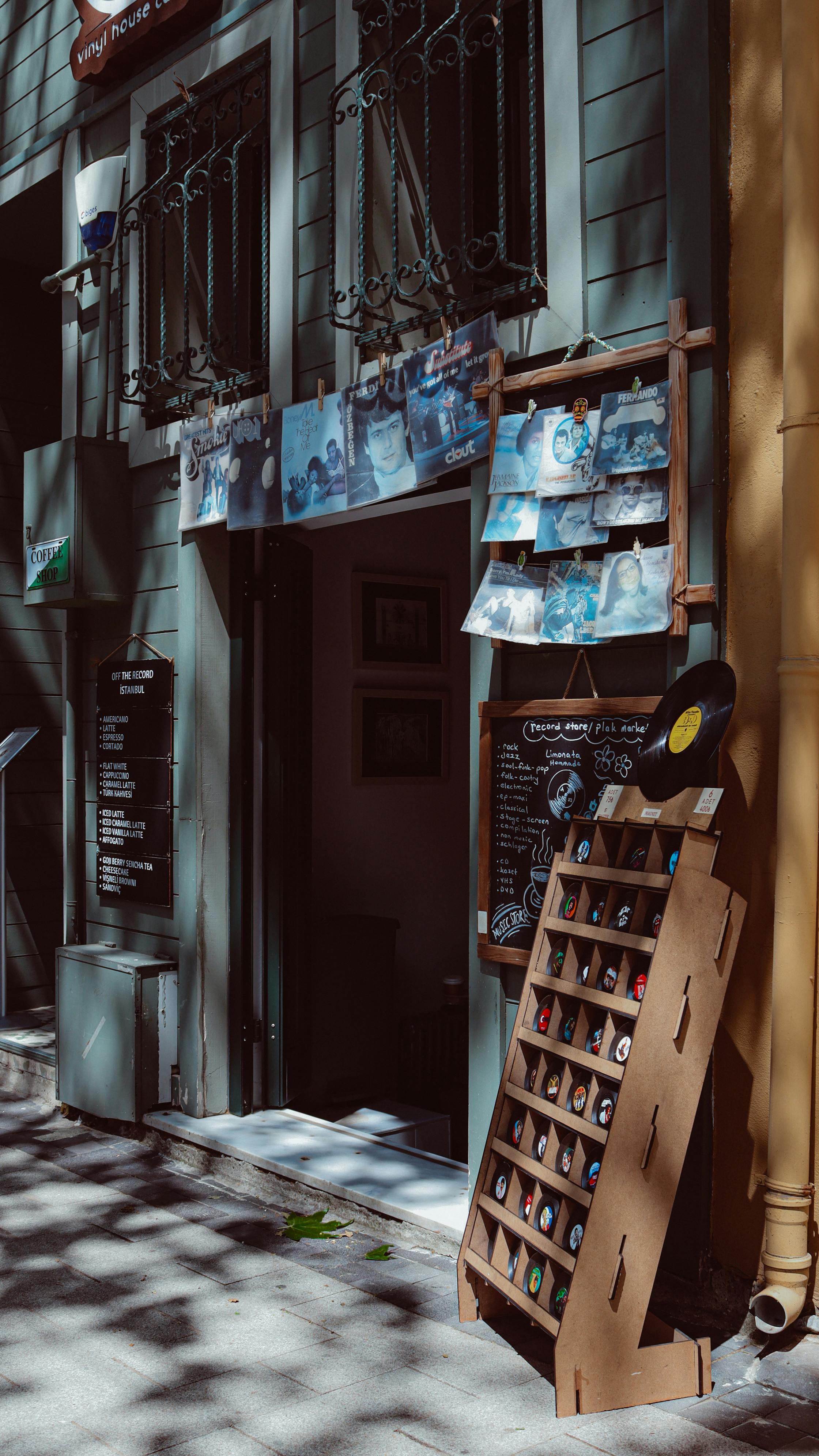 Cozy Vintage Record Storefront with Vinyl Display · Free Stock Photo