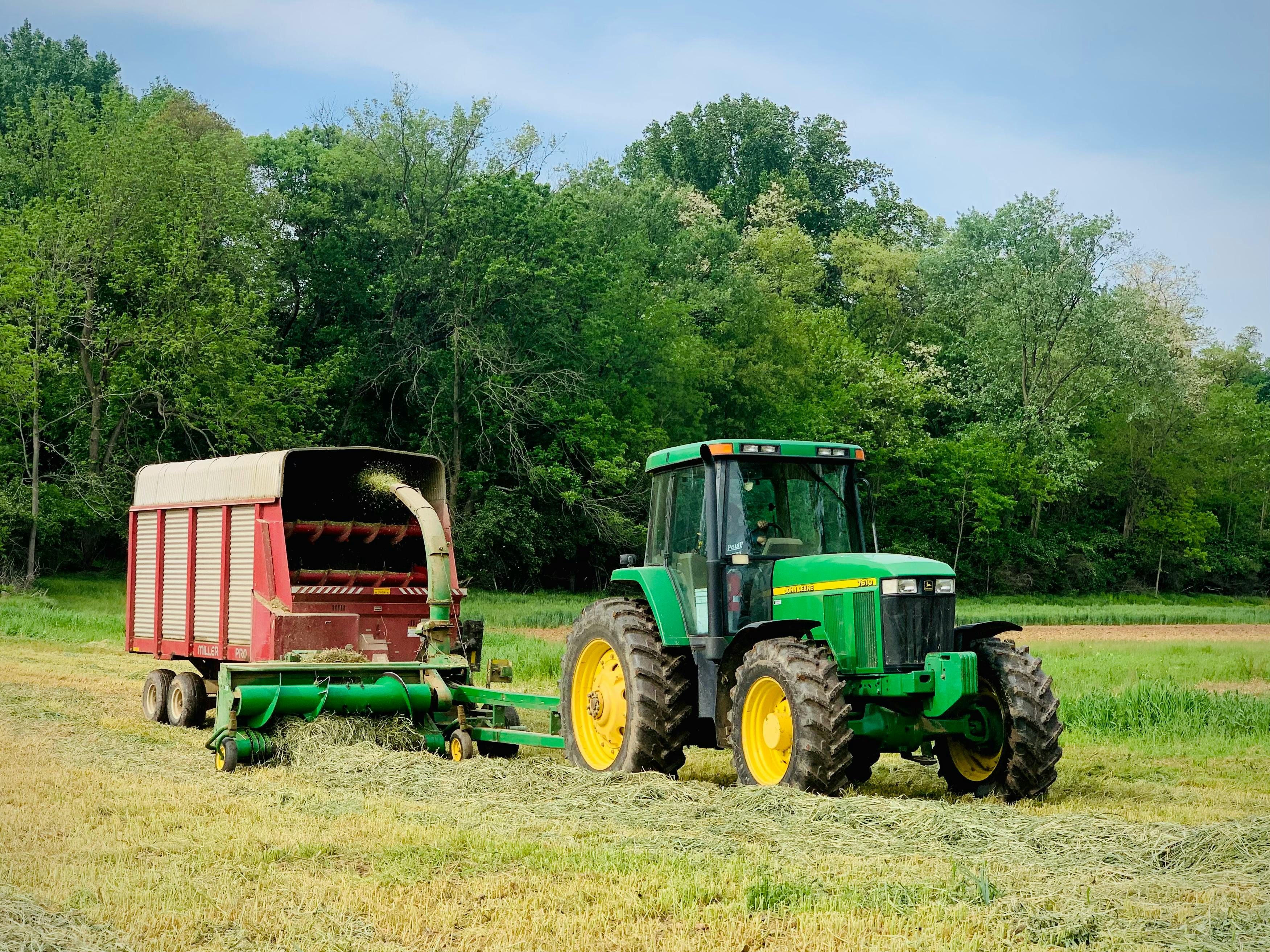 Green Tractor Harvesting Hay in Lancaster Field · Free Stock Photo