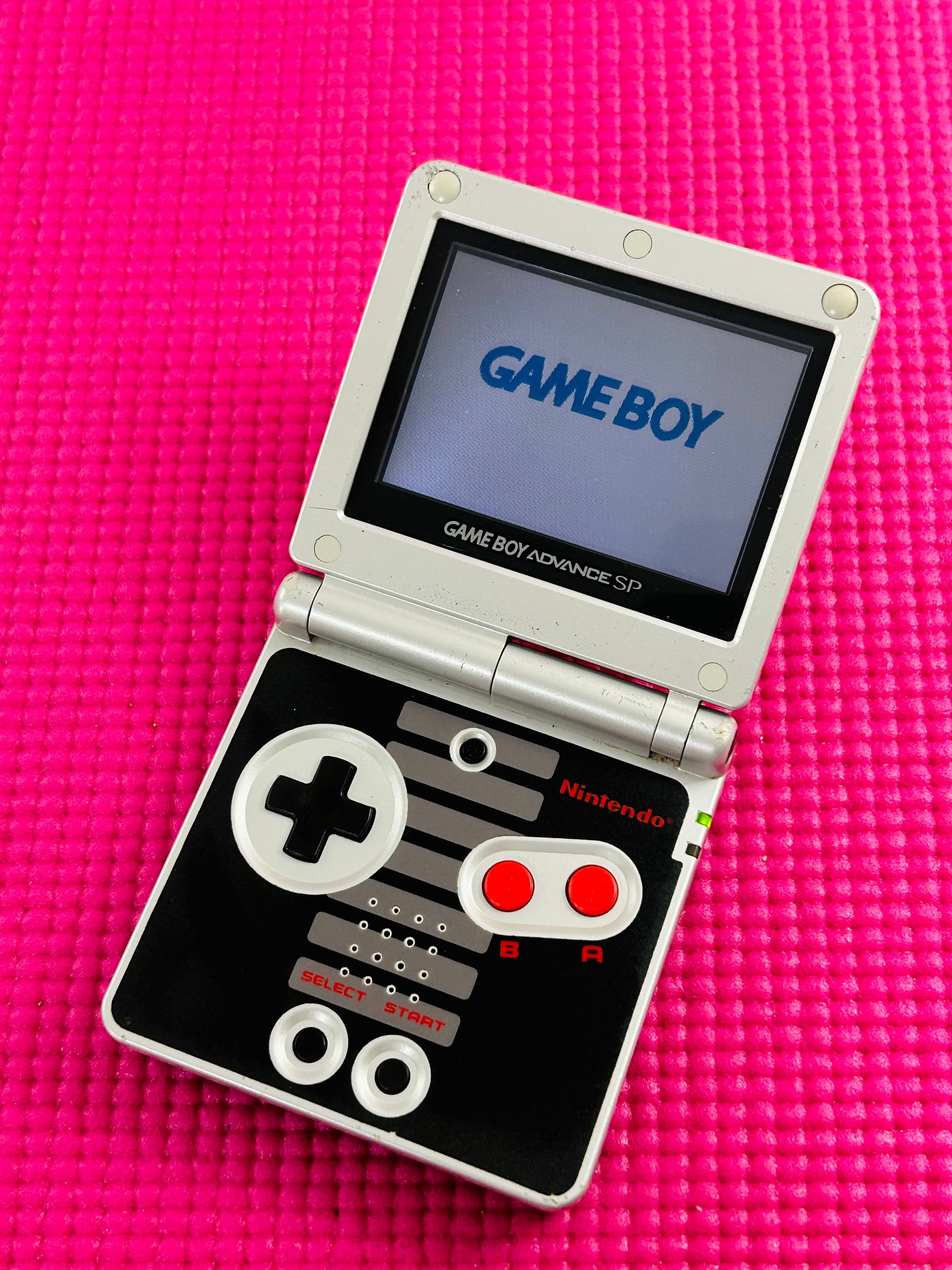 Retro Game Boy Advance SP on Pink Background · Free Stock Photo