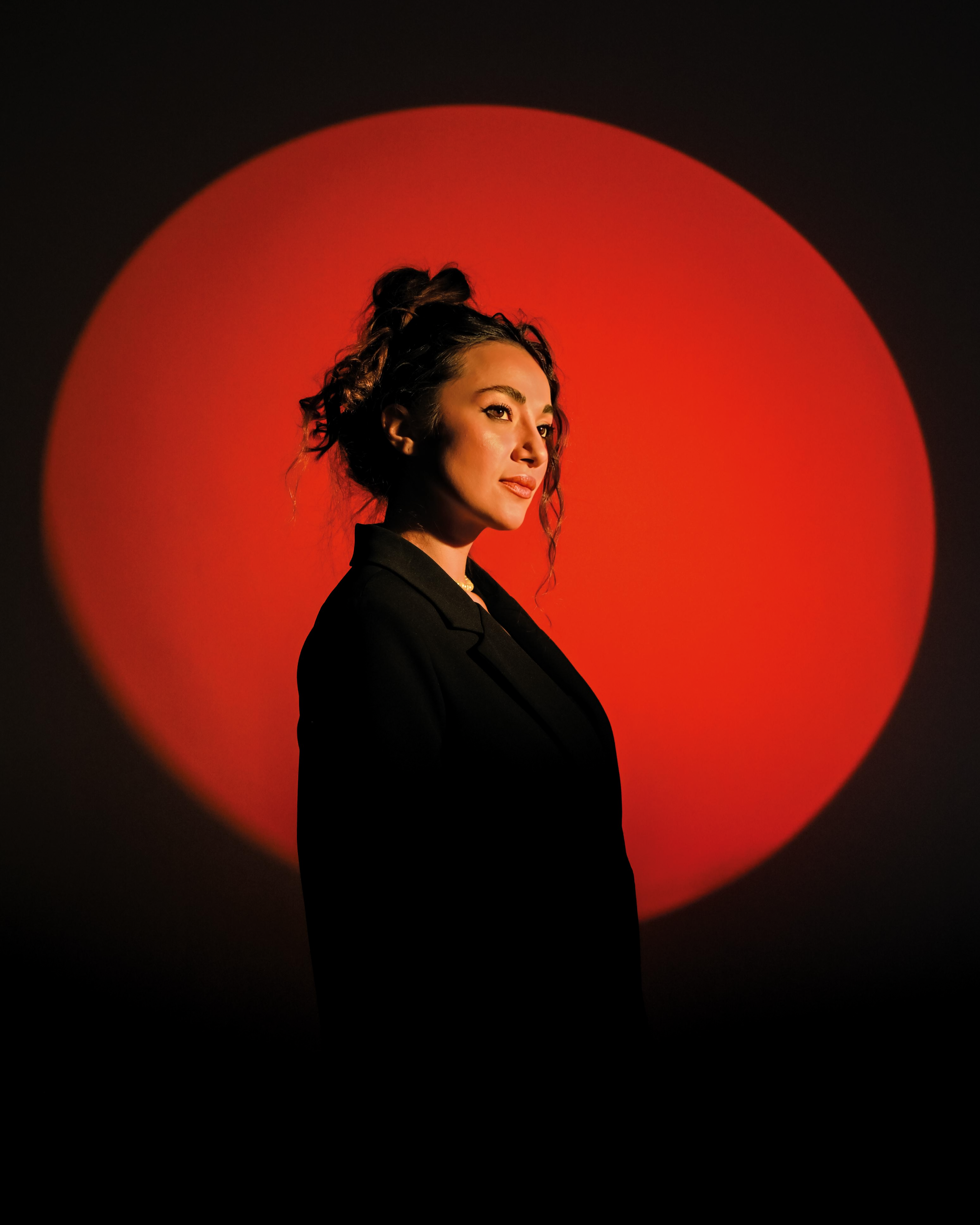 Dramatic Portrait with Red Spotlight Background · Free Stock Photo