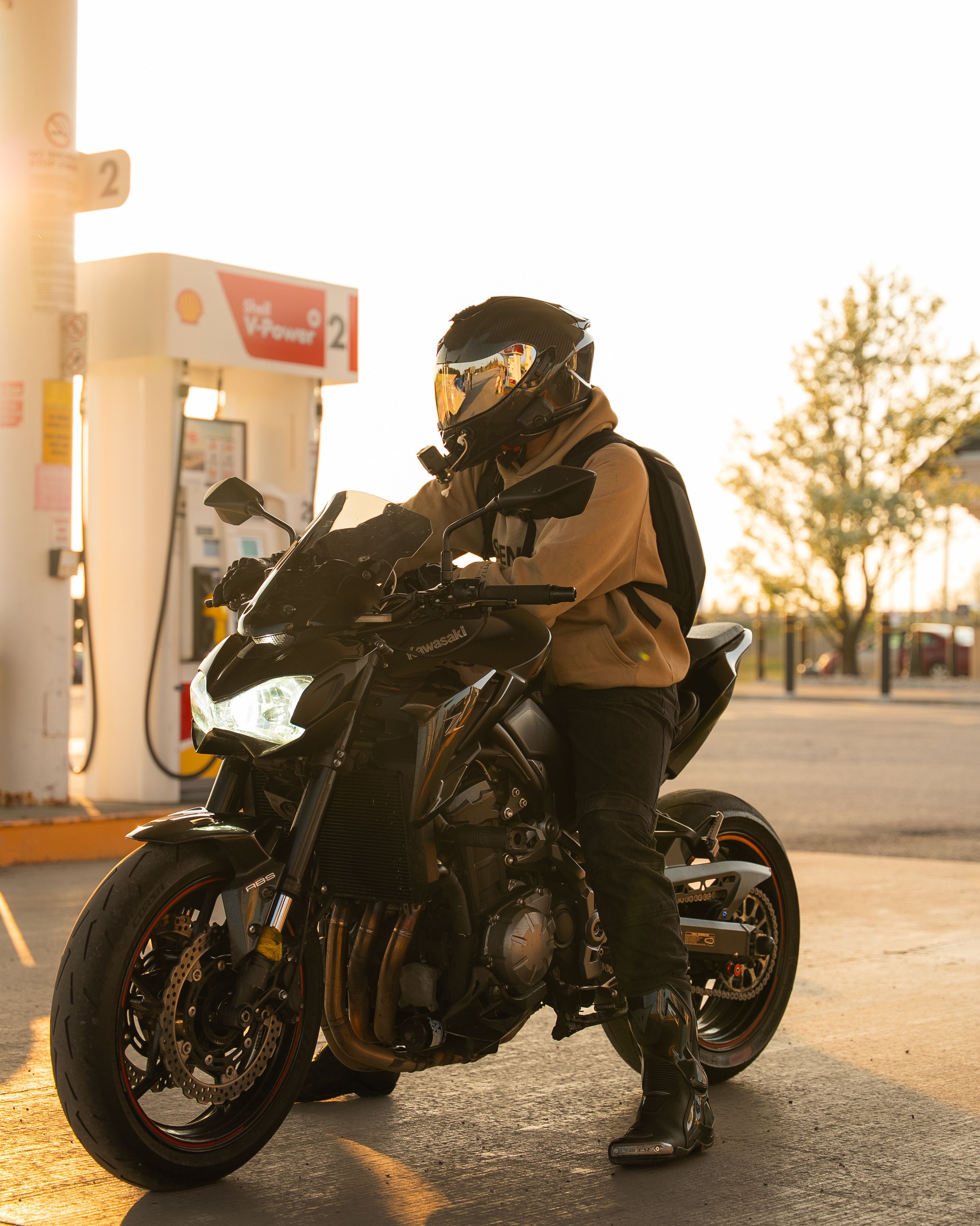 Motorcyclist Refueling at Gas Station during Day · Free Stock Photo