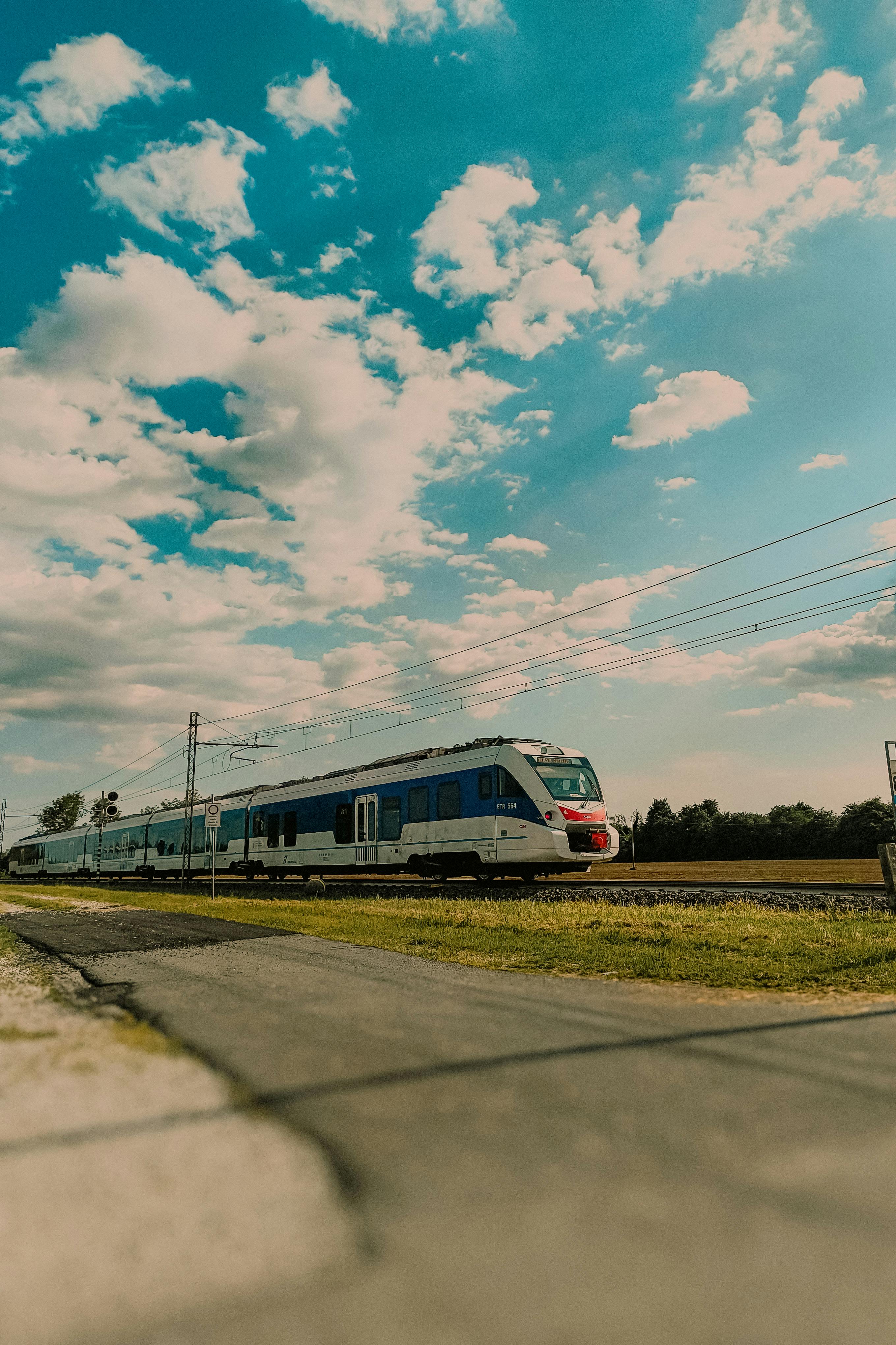 Modern Train Traveling Through Scenic Countryside · Free Stock Photo