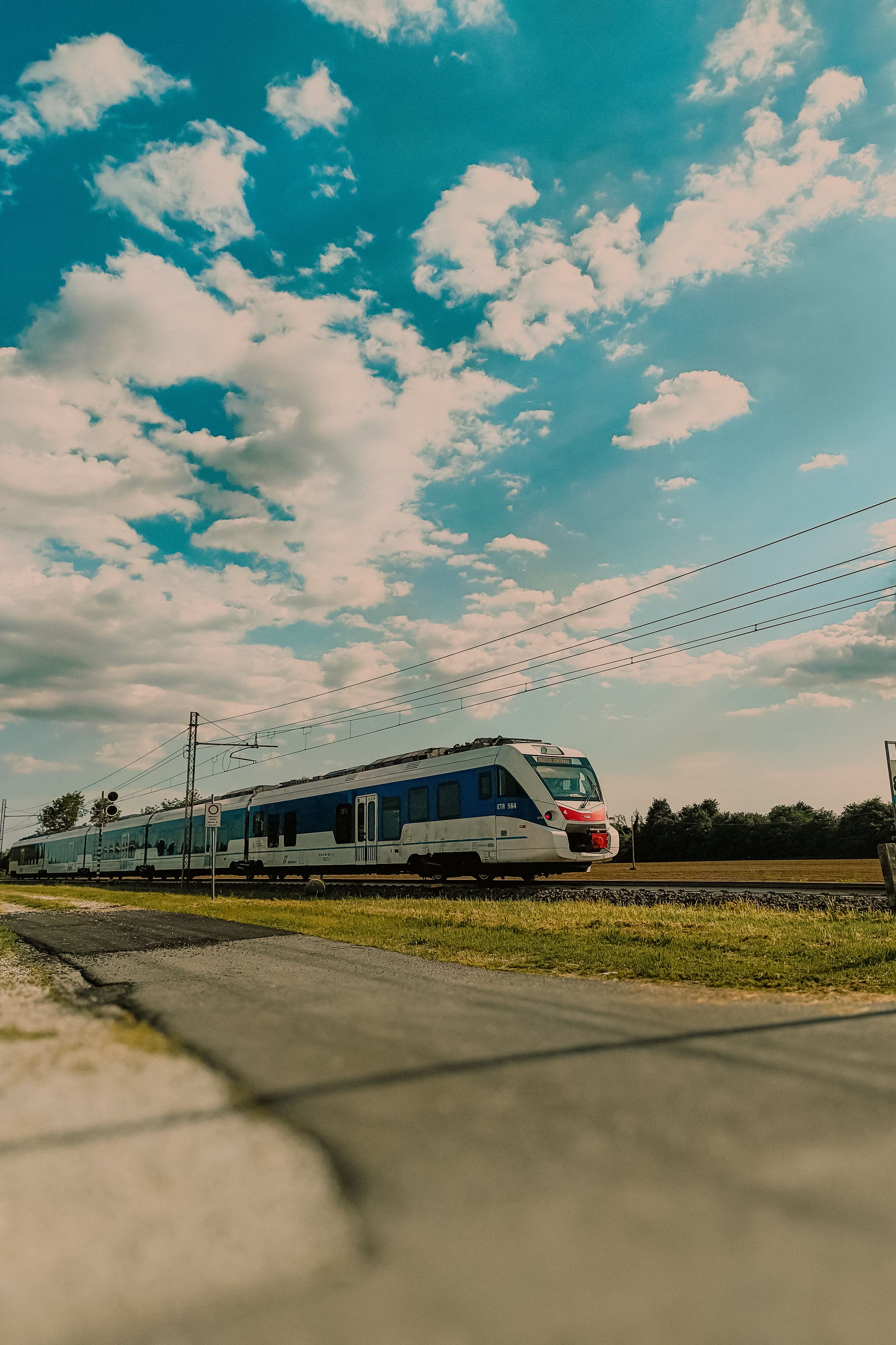 Modern Train Traveling Through Scenic Countryside · Free Stock Photo